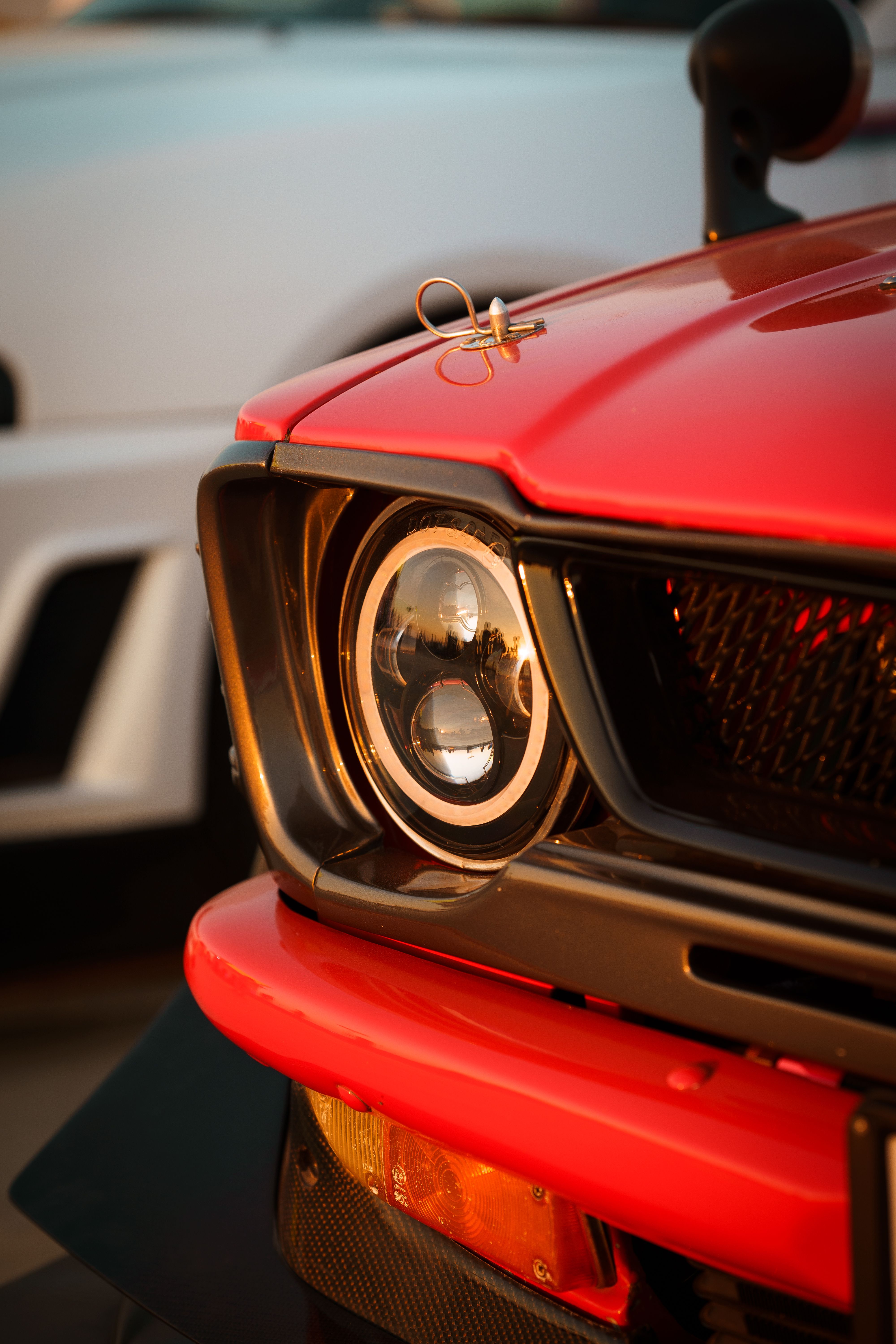 Close-up vintage red car at sunset · Free Stock Photo