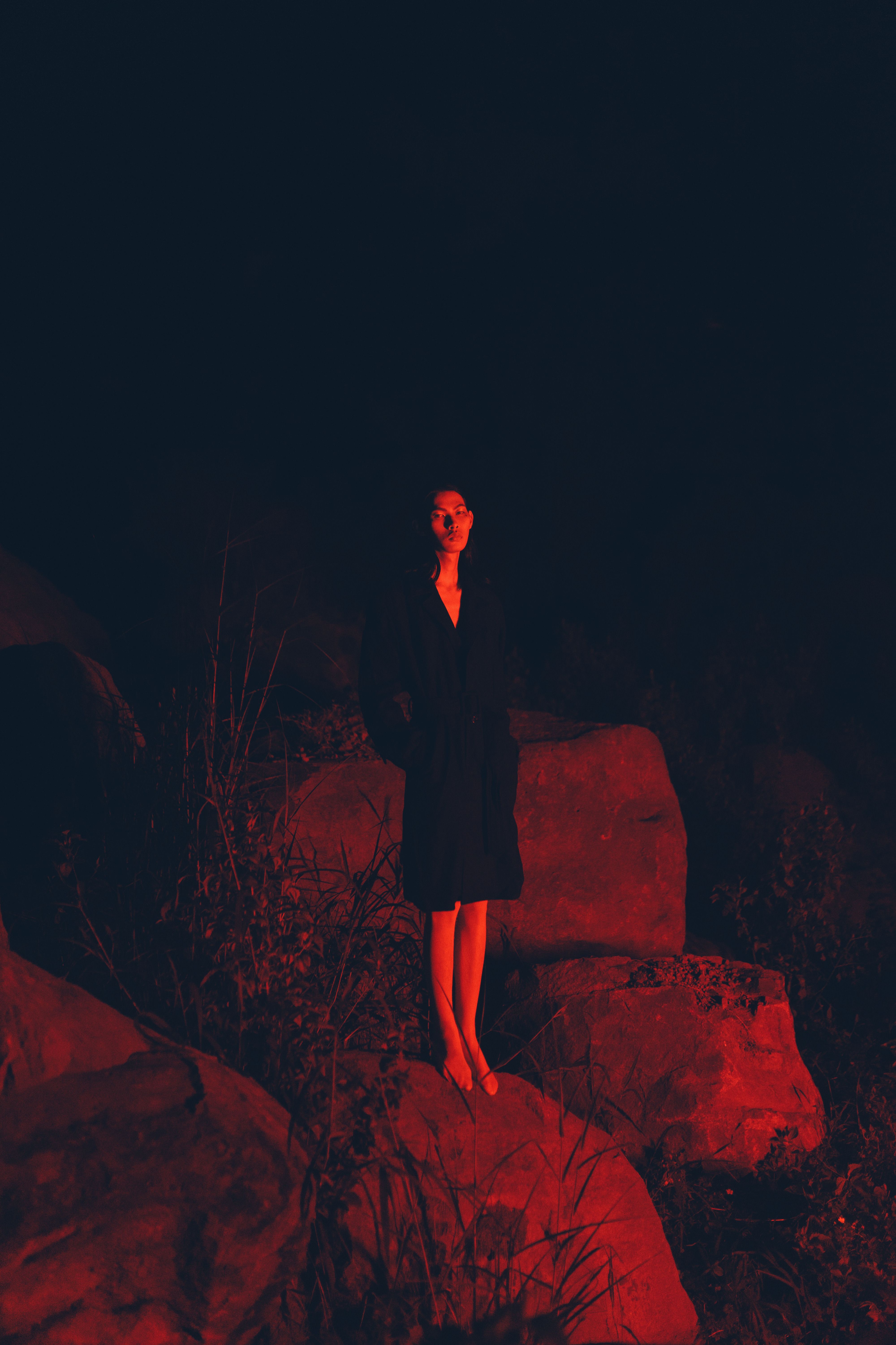 Moody Portrait of a Woman in Red Light Outdoors · Free Stock Photo