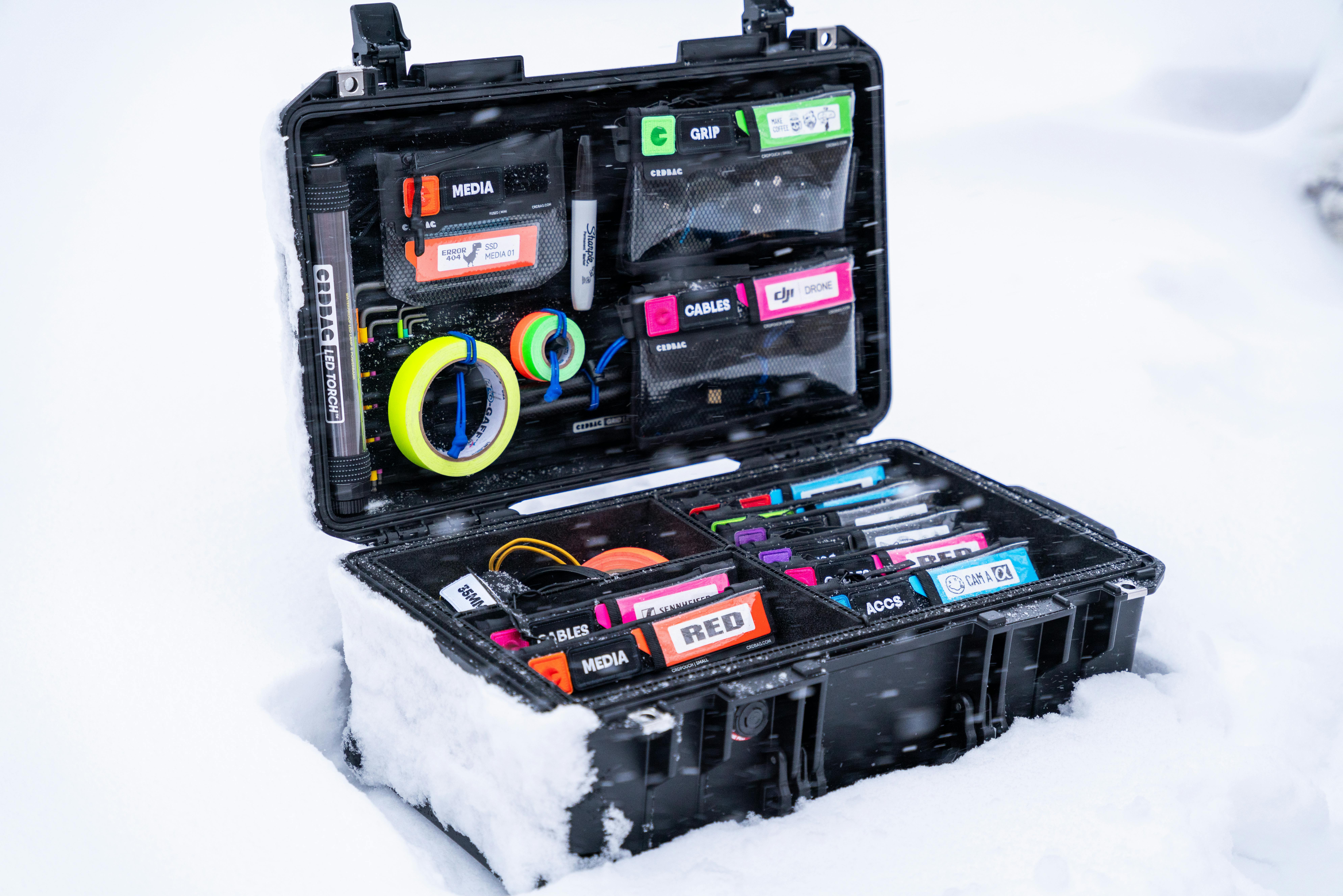 Organized Equipment Case in Snowy Environment · Free Stock Photo