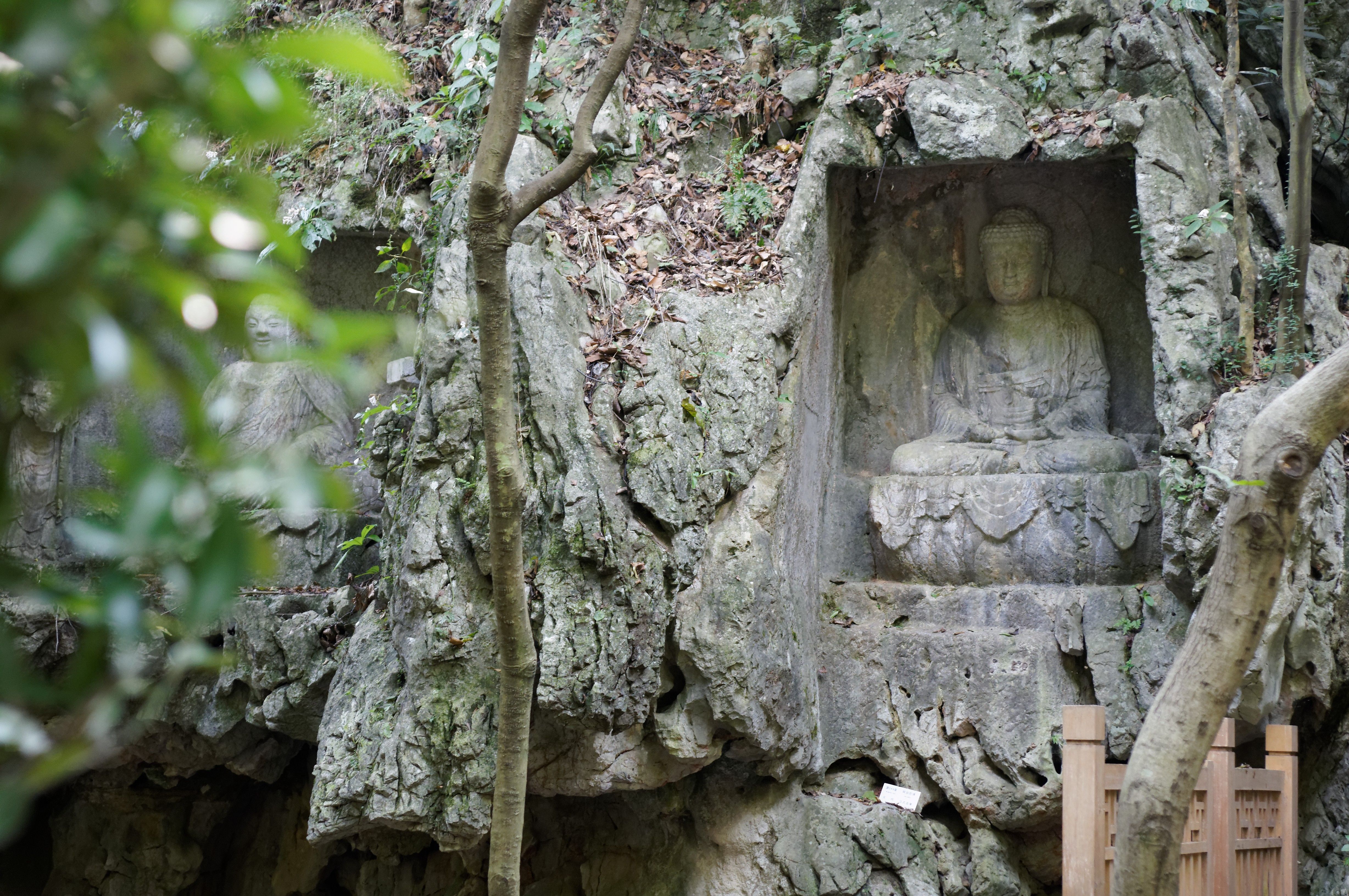 Ancient Buddha Statue in Rocky Cave Niche · Free Stock Photo