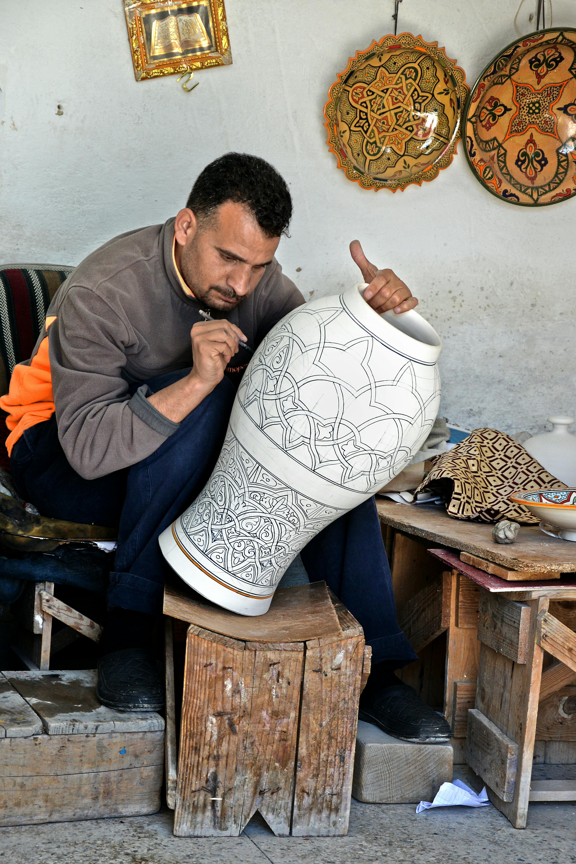 Moroccan Artisan Crafting Traditional Pottery · Free Stock Photo