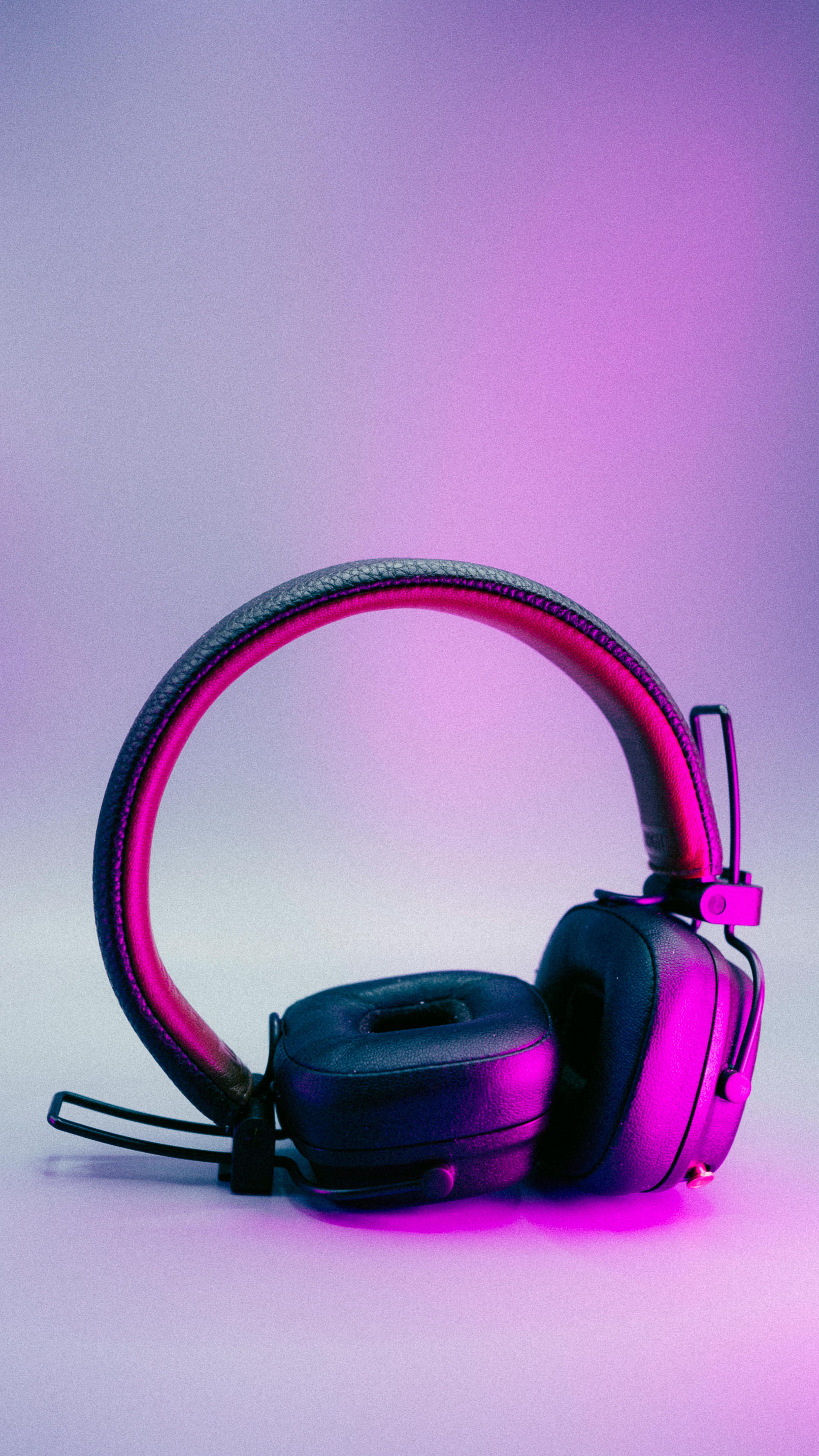 Vibrant Neon Headphones on Gradient Background · Free Stock Photo
