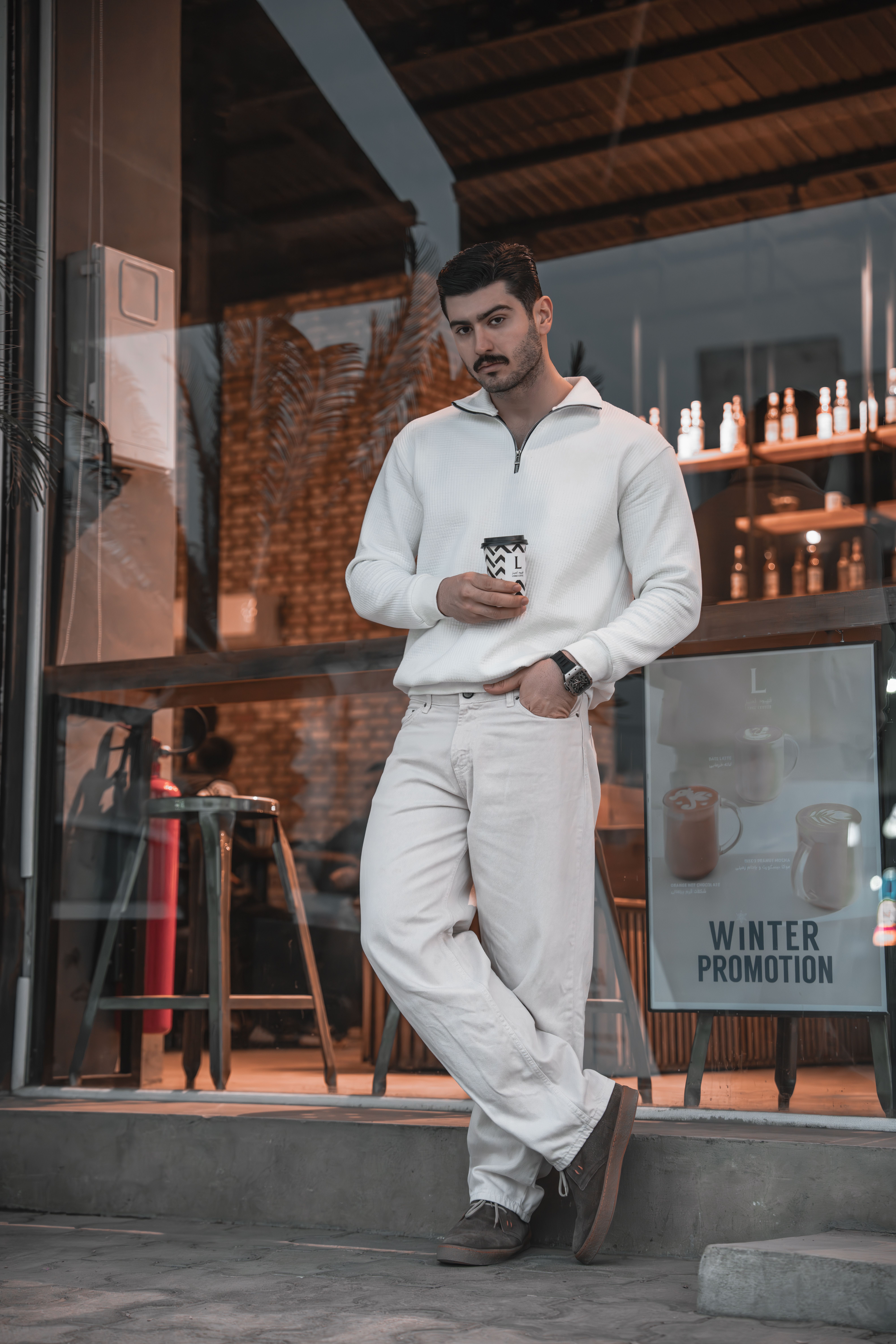 Man Enjoying Coffee in Stylish Café Setting · Free Stock Photo