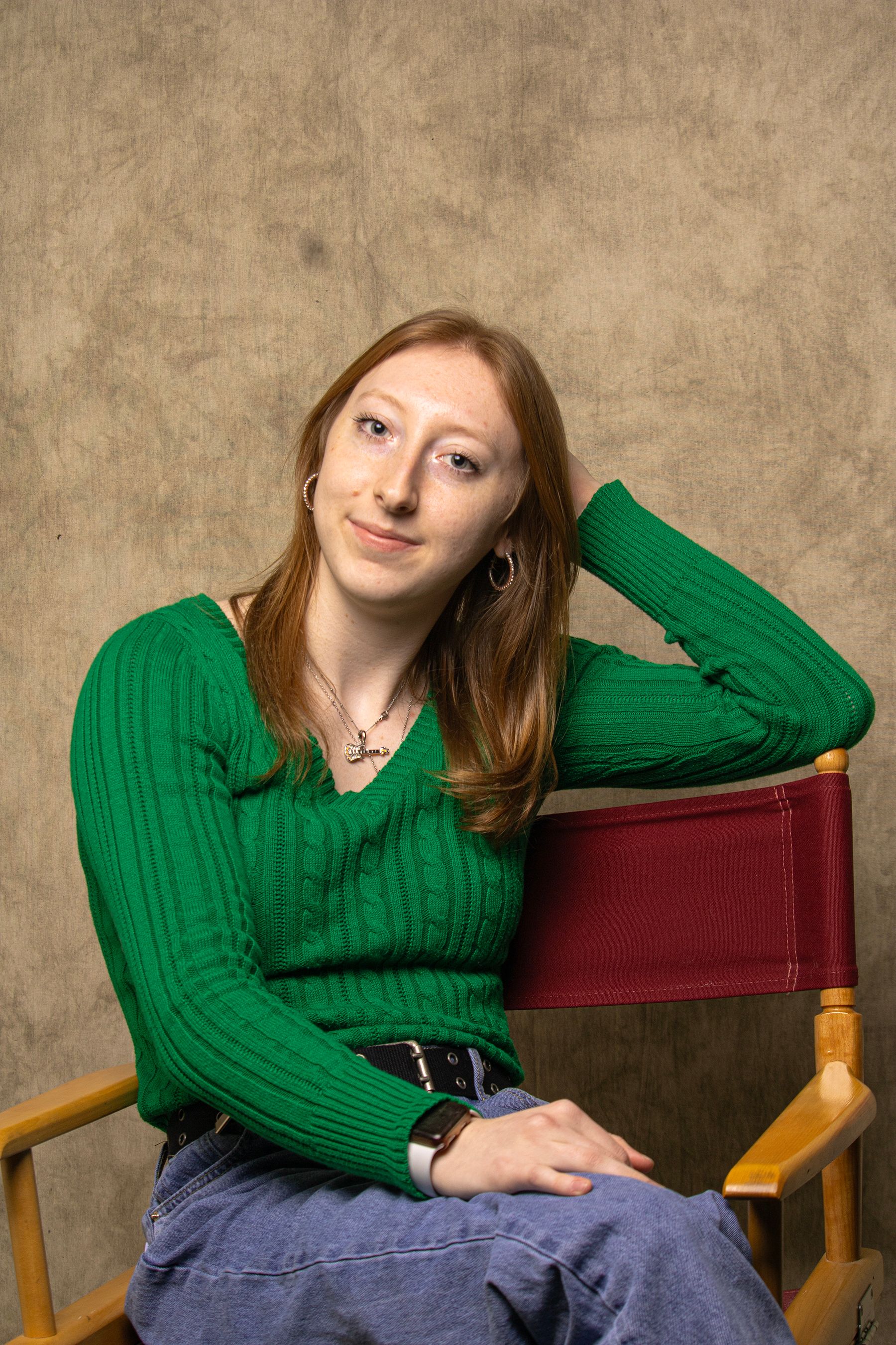 Casual Portrait of a Woman Sitting in Studio · Free Stock Photo