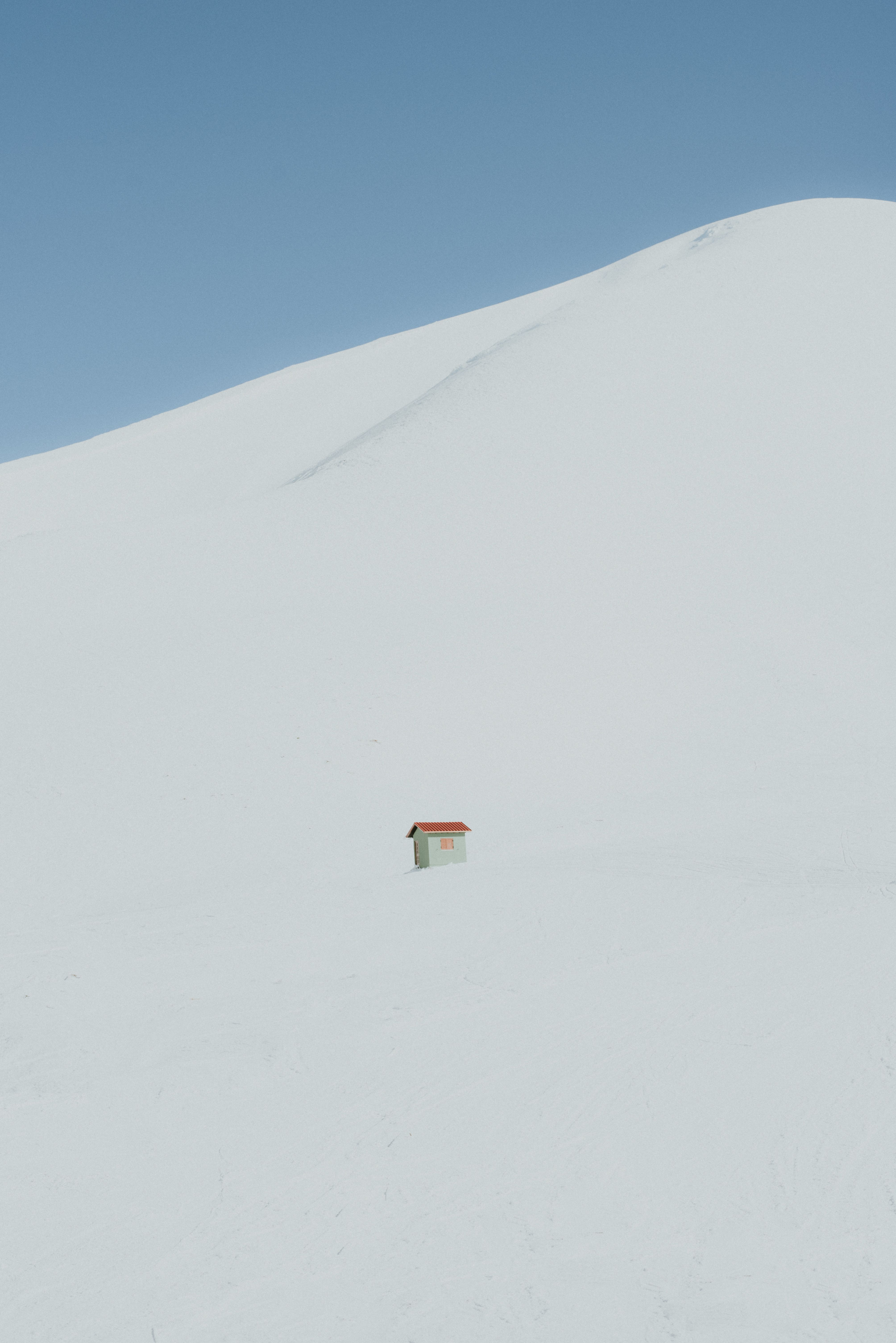 Isolated Cabin in Vast Snowy Landscape · Free Stock Photo