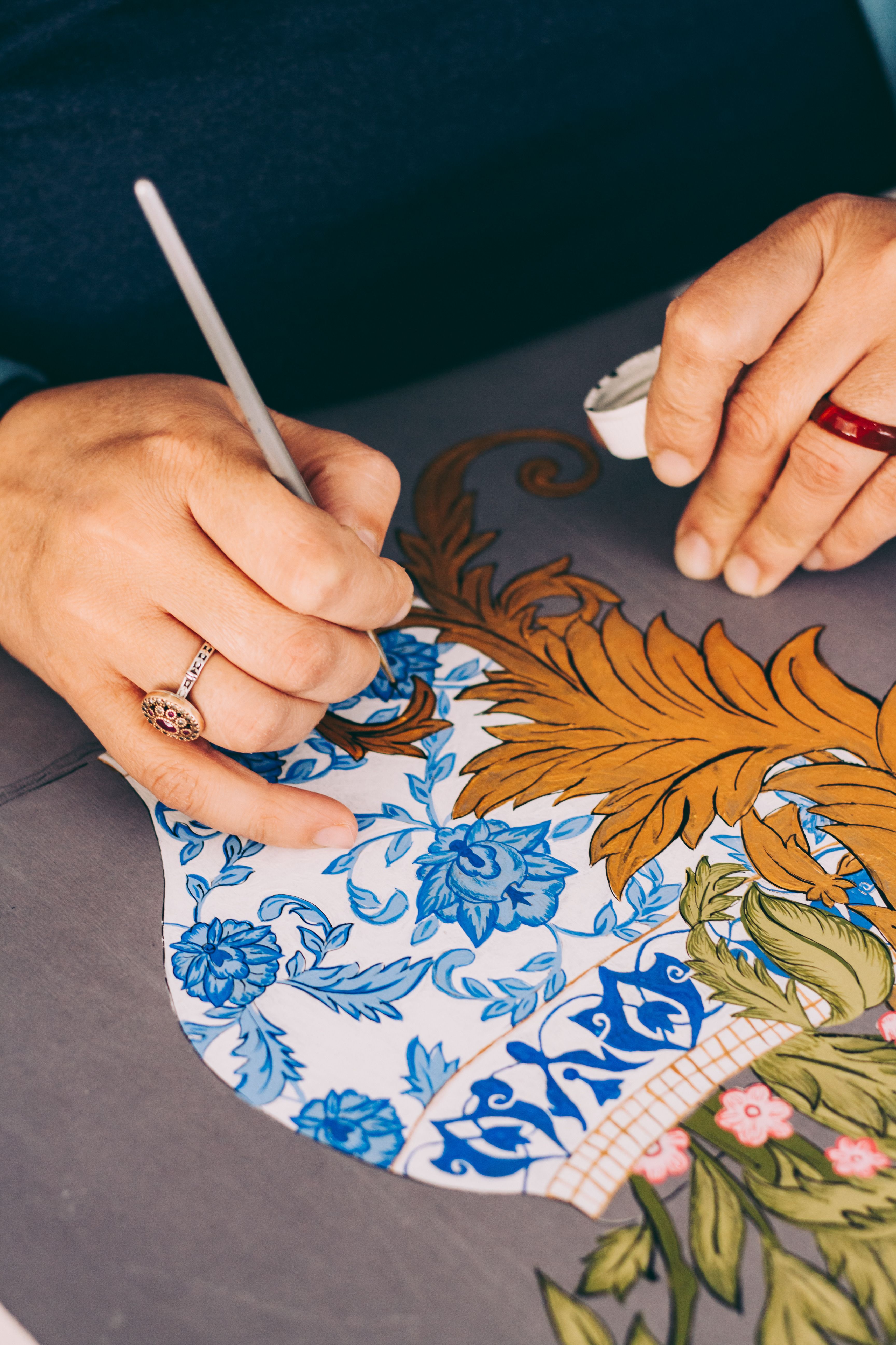 Artisan Hand-Painting Floral Pottery Design · Free Stock Photo