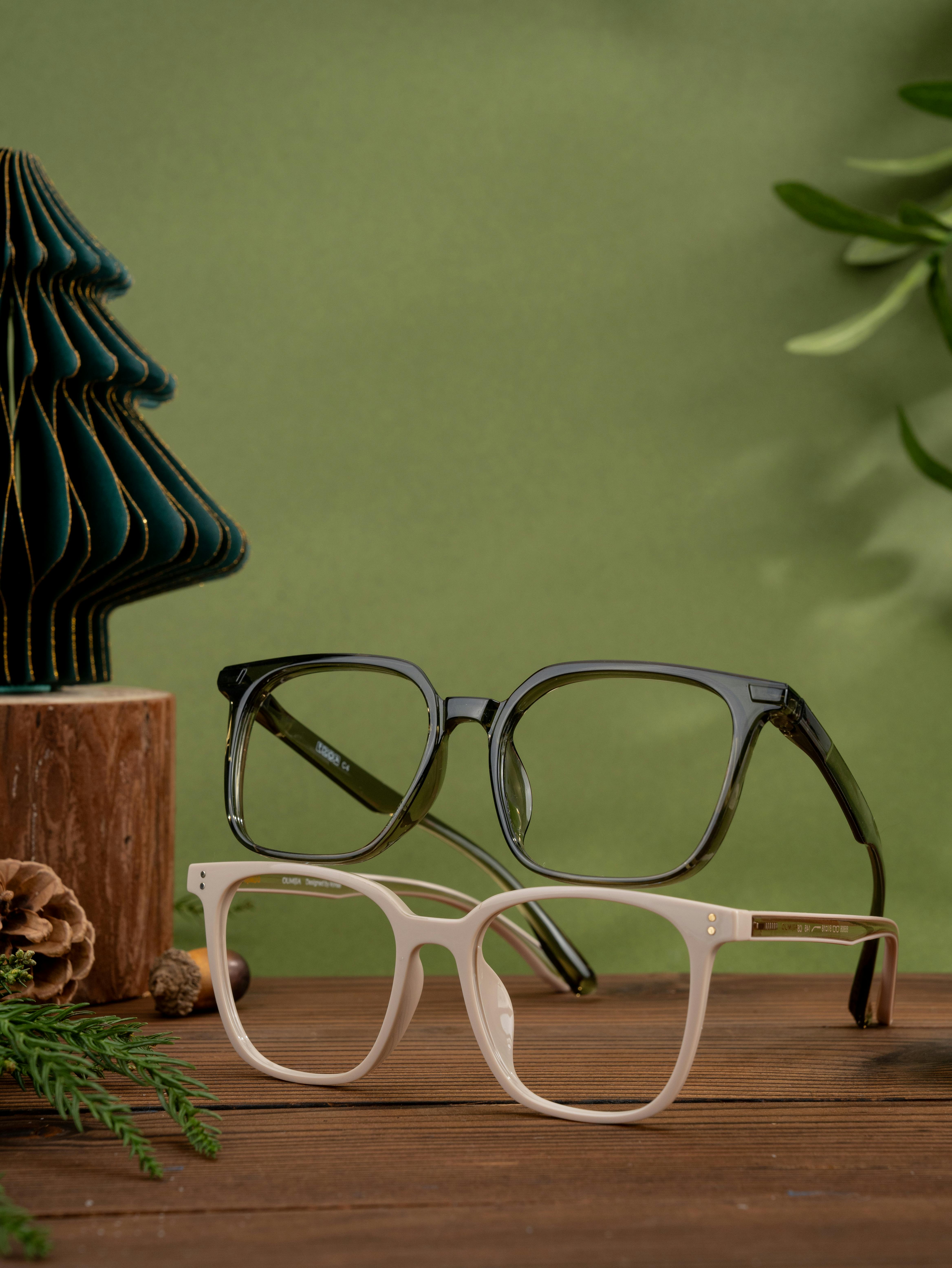 Stylish Eyewear Display on Wooden Table · Free Stock Photo