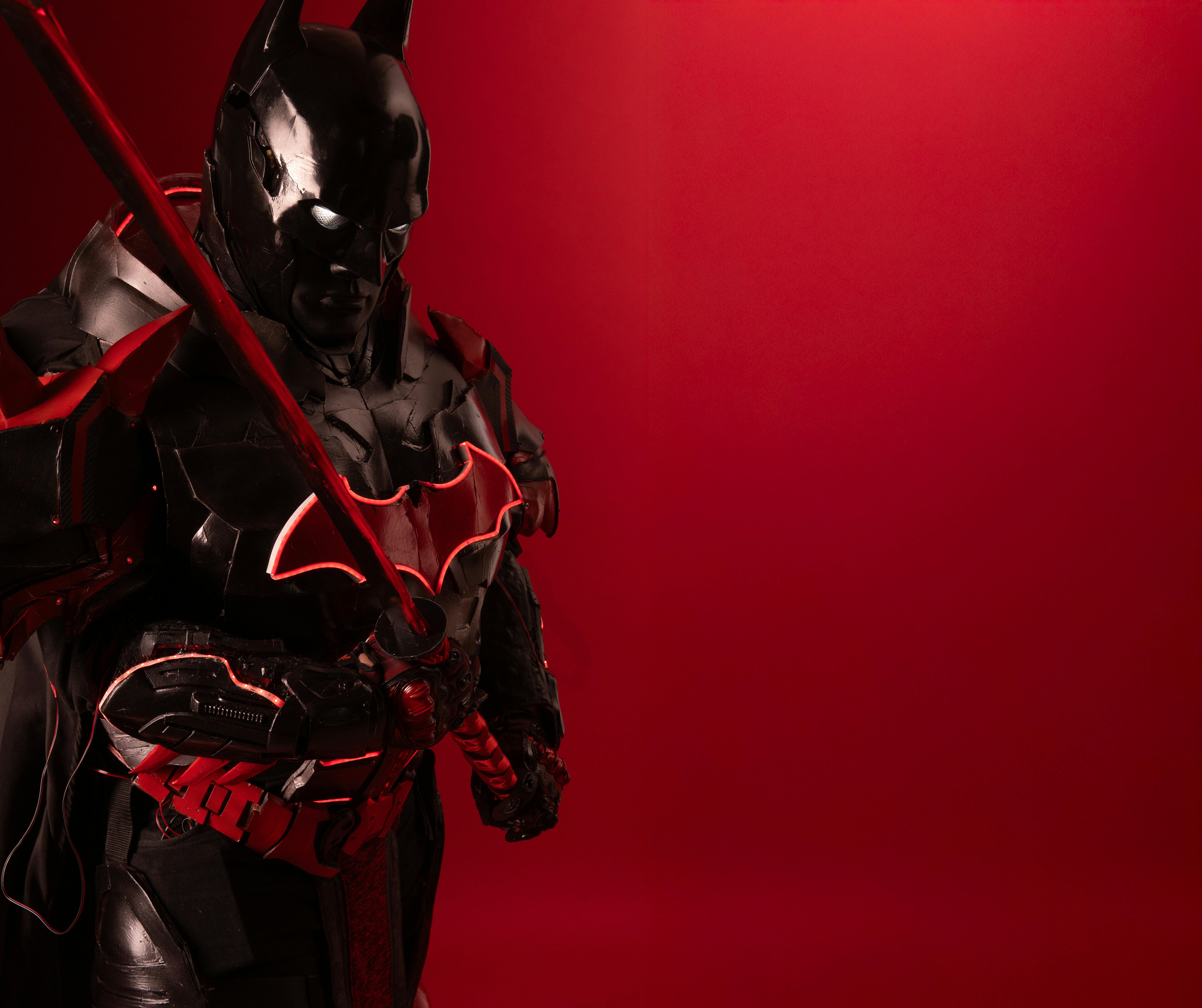 Dramatic Batman Cosplay with Red Background · Free Stock Photo