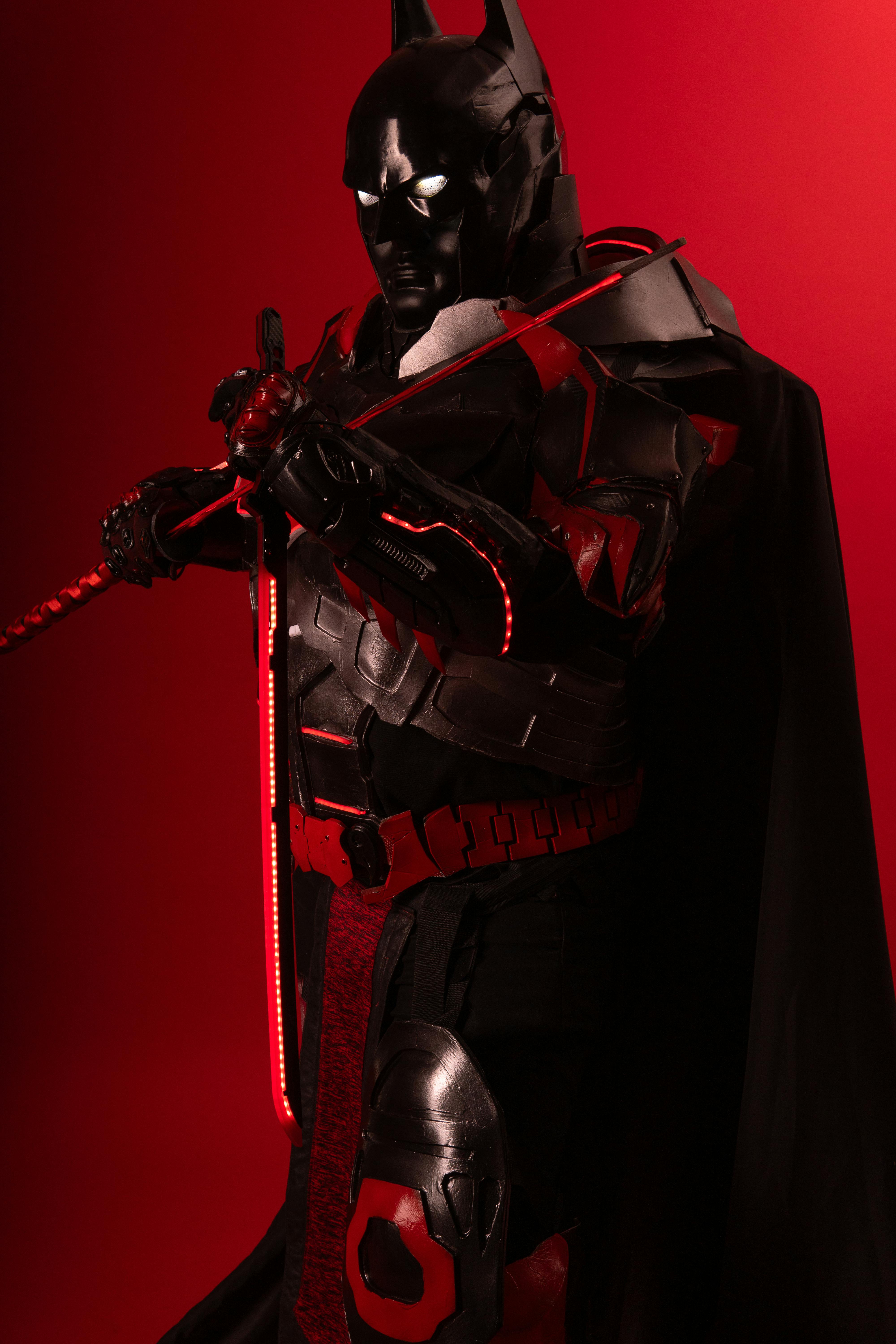 Dynamic Batman Cosplay in Black and Red Armor · Free Stock Photo