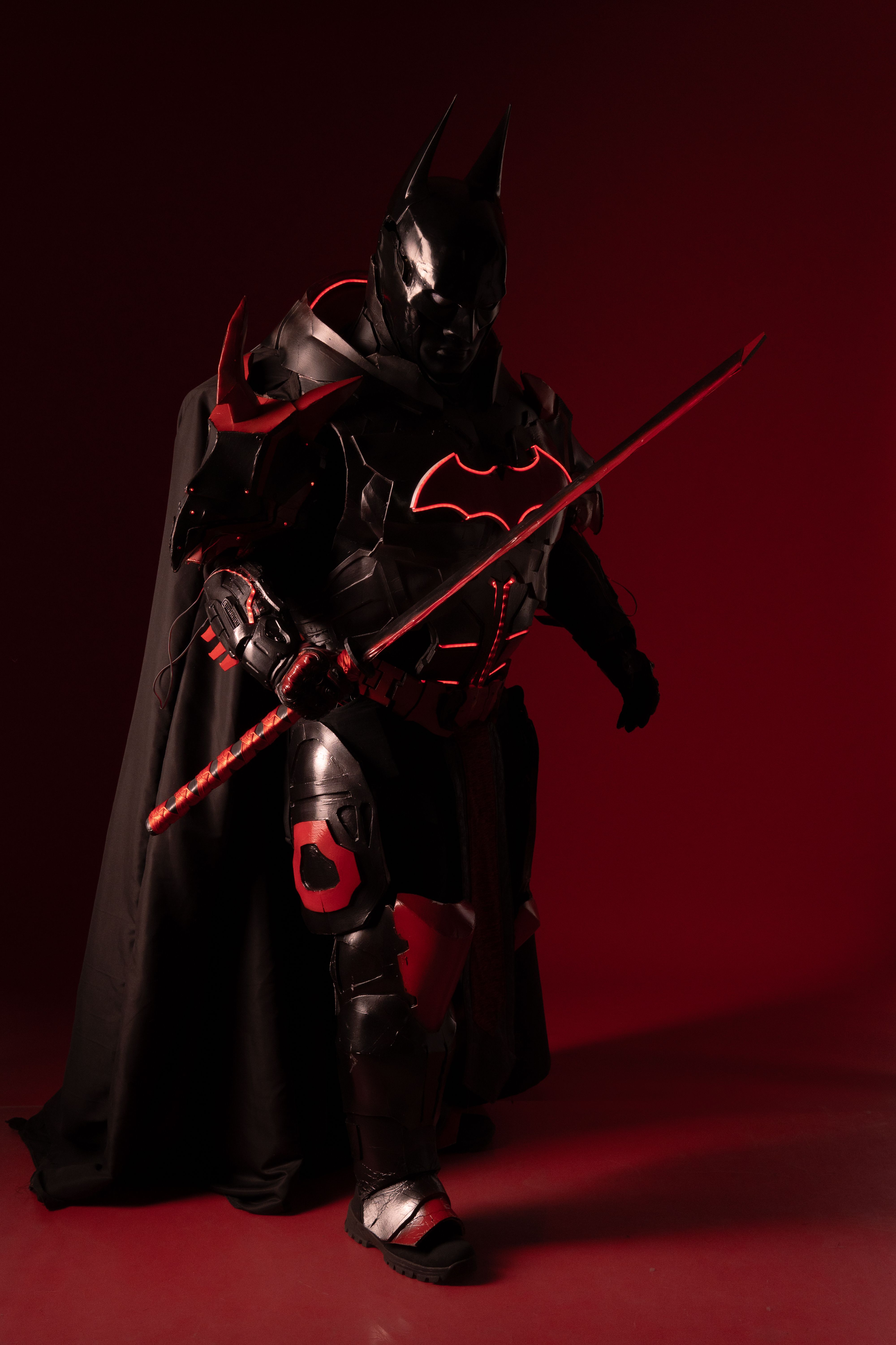 Dark Knight Cosplay with Red Accents · Free Stock Photo
