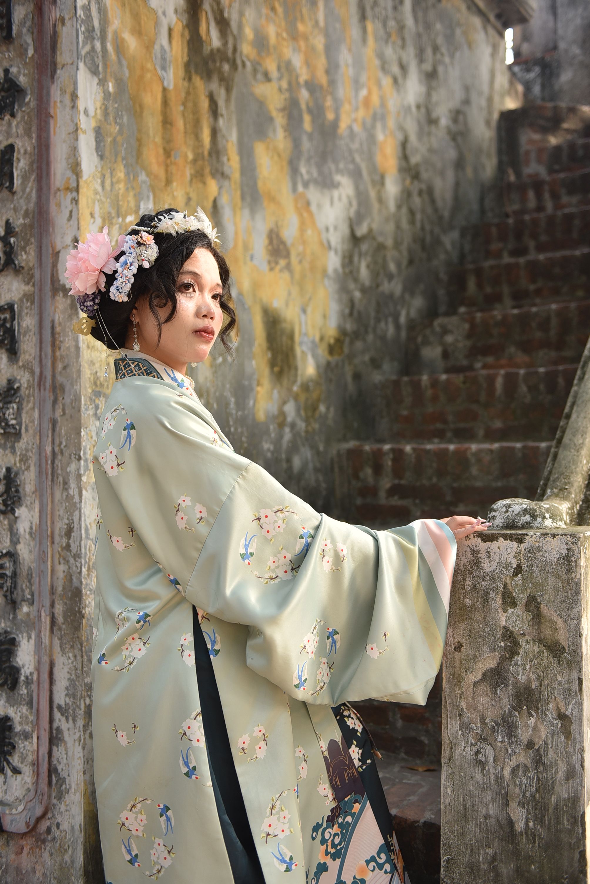 Traditional Asian Attire Woman in Historical Setting · Free Stock Photo