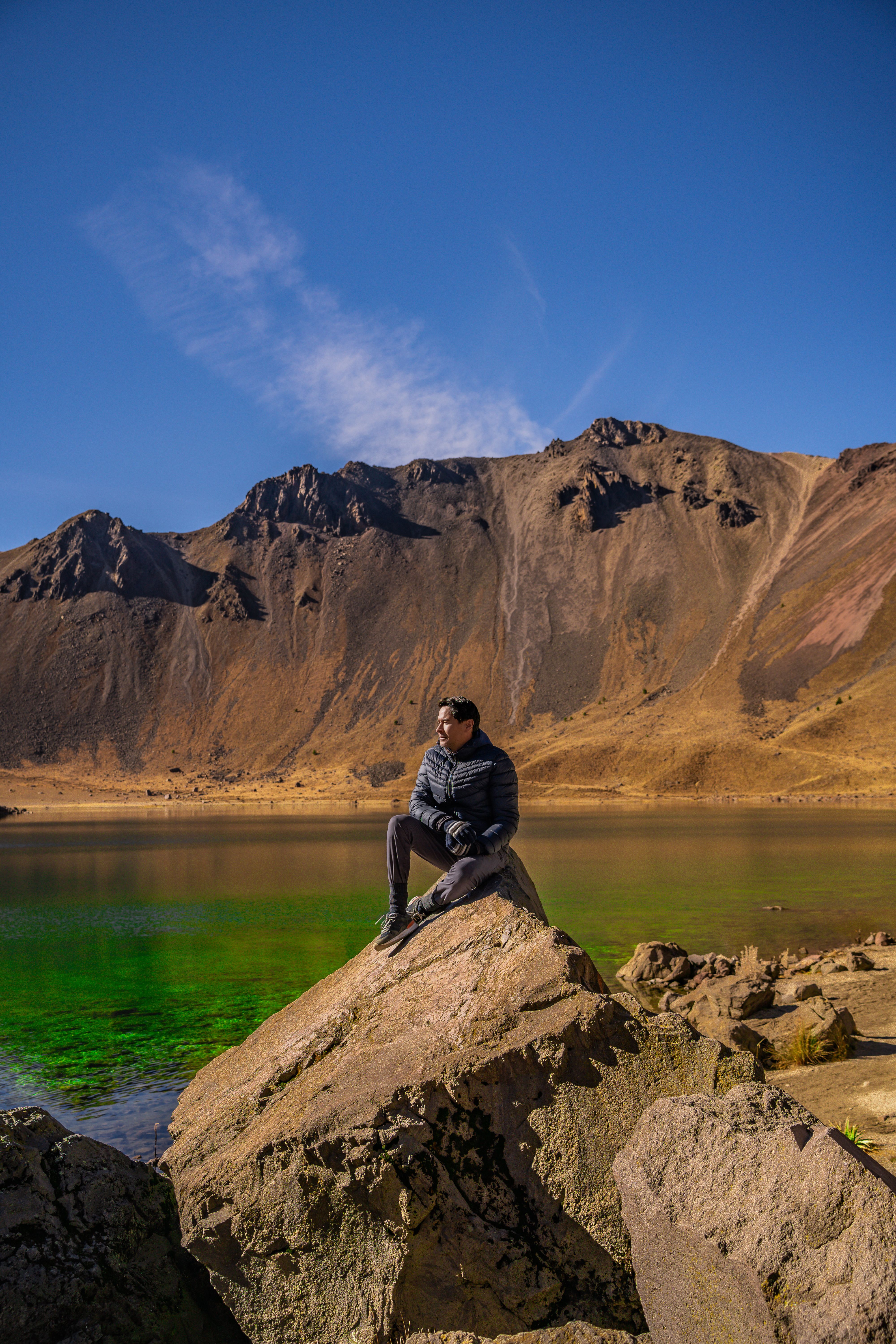 Man Relaxing by Lago del Sol in Toluca, Mexico · Free Stock Photo