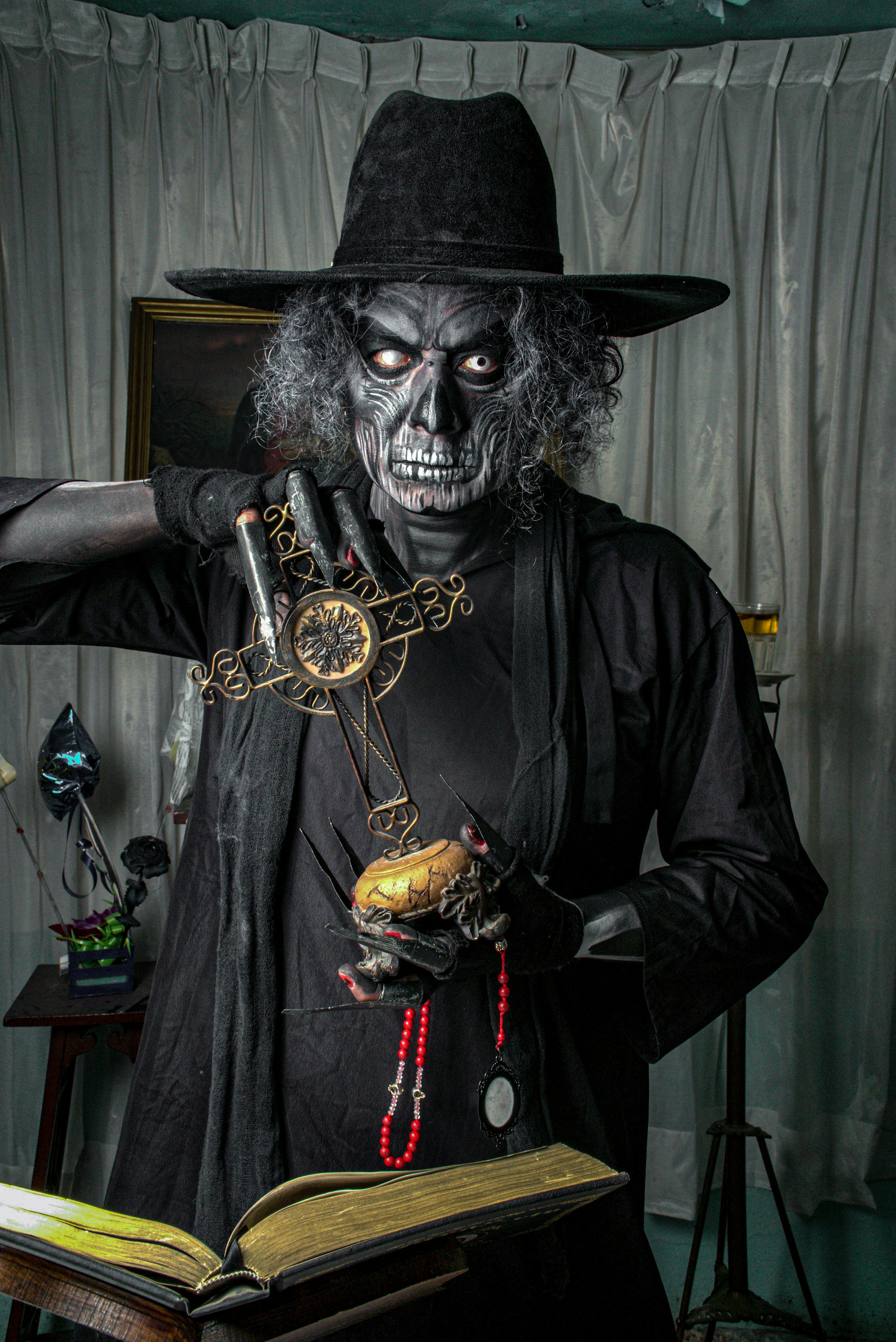 Gothic Creature with Cross in Dark Artistic Setting · Free Stock Photo