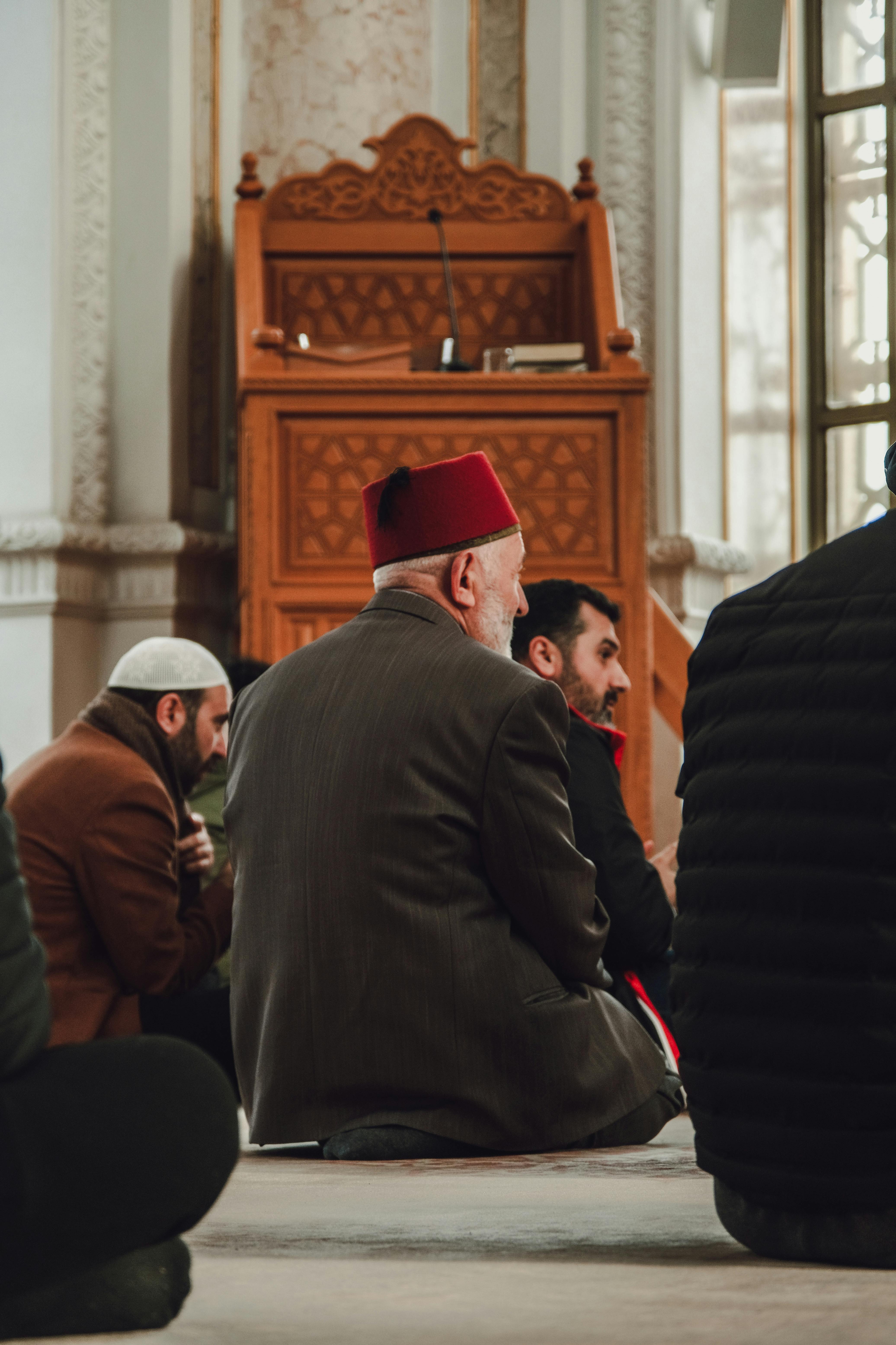 Men in Traditional Attire Praying Inside Mosque · Free Stock Photo