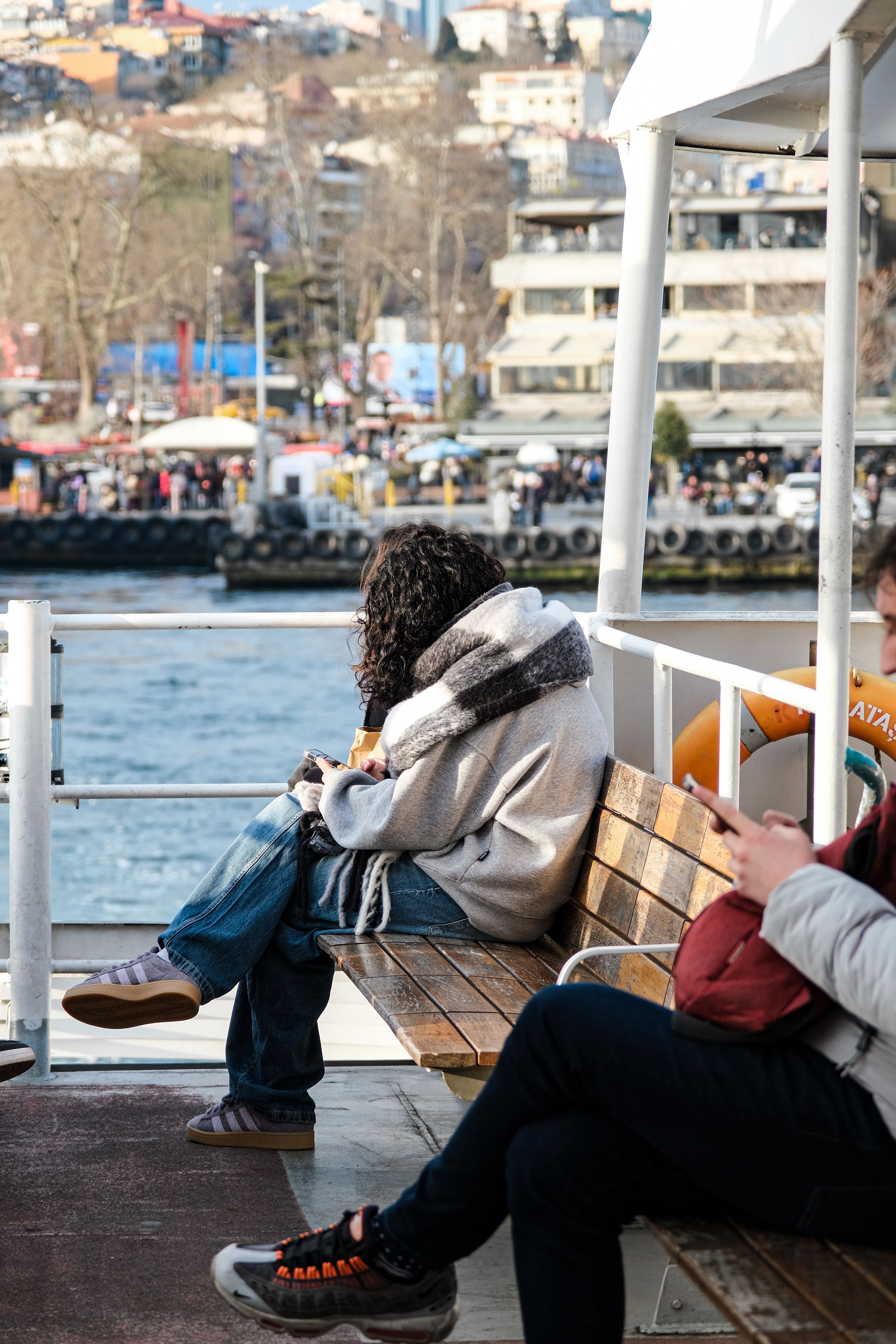 Two People Relaxing on a Ferry Ride · Free Stock Photo