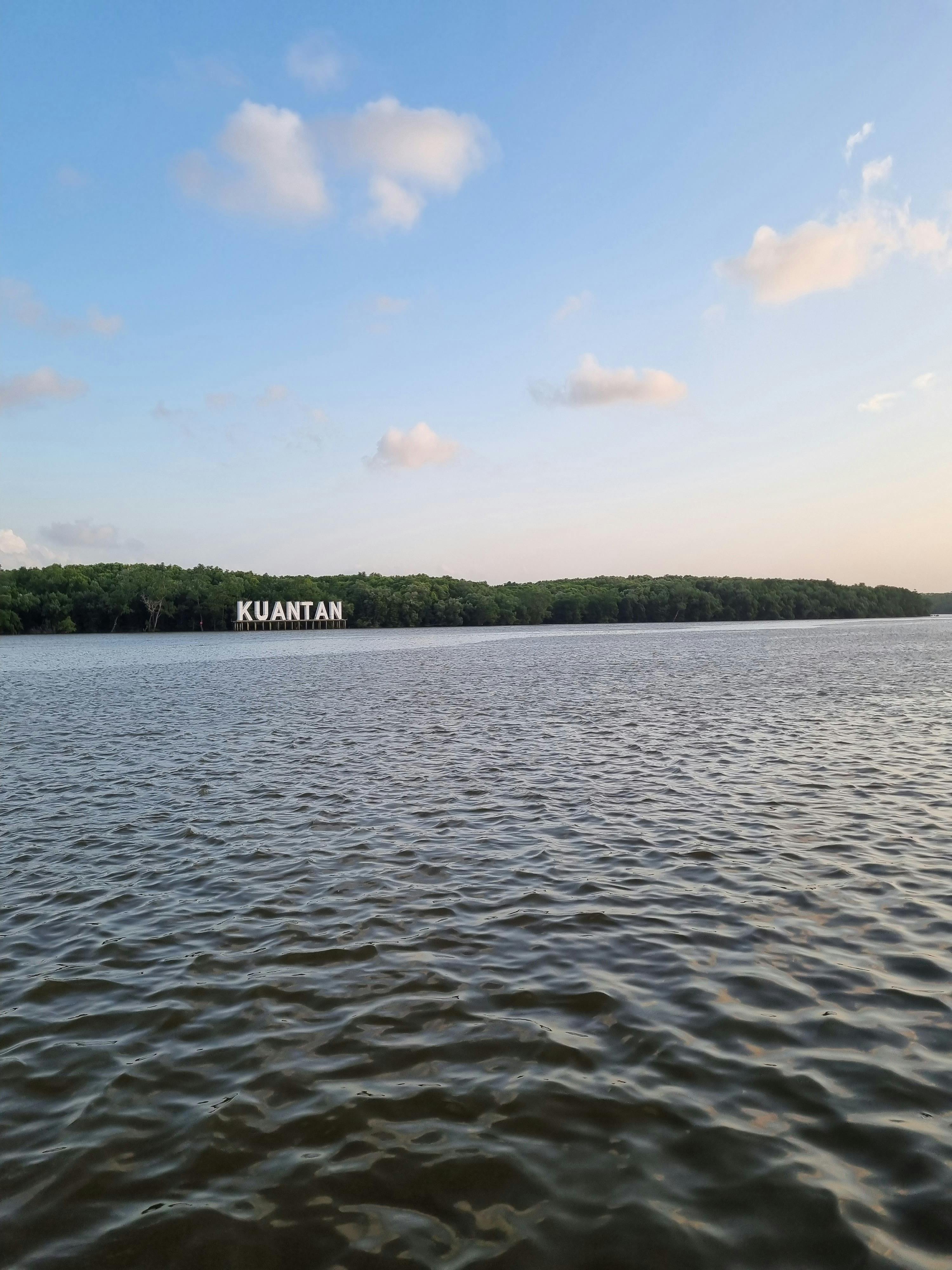 Scenic Kuantan River view with blue sky · Free Stock Photo