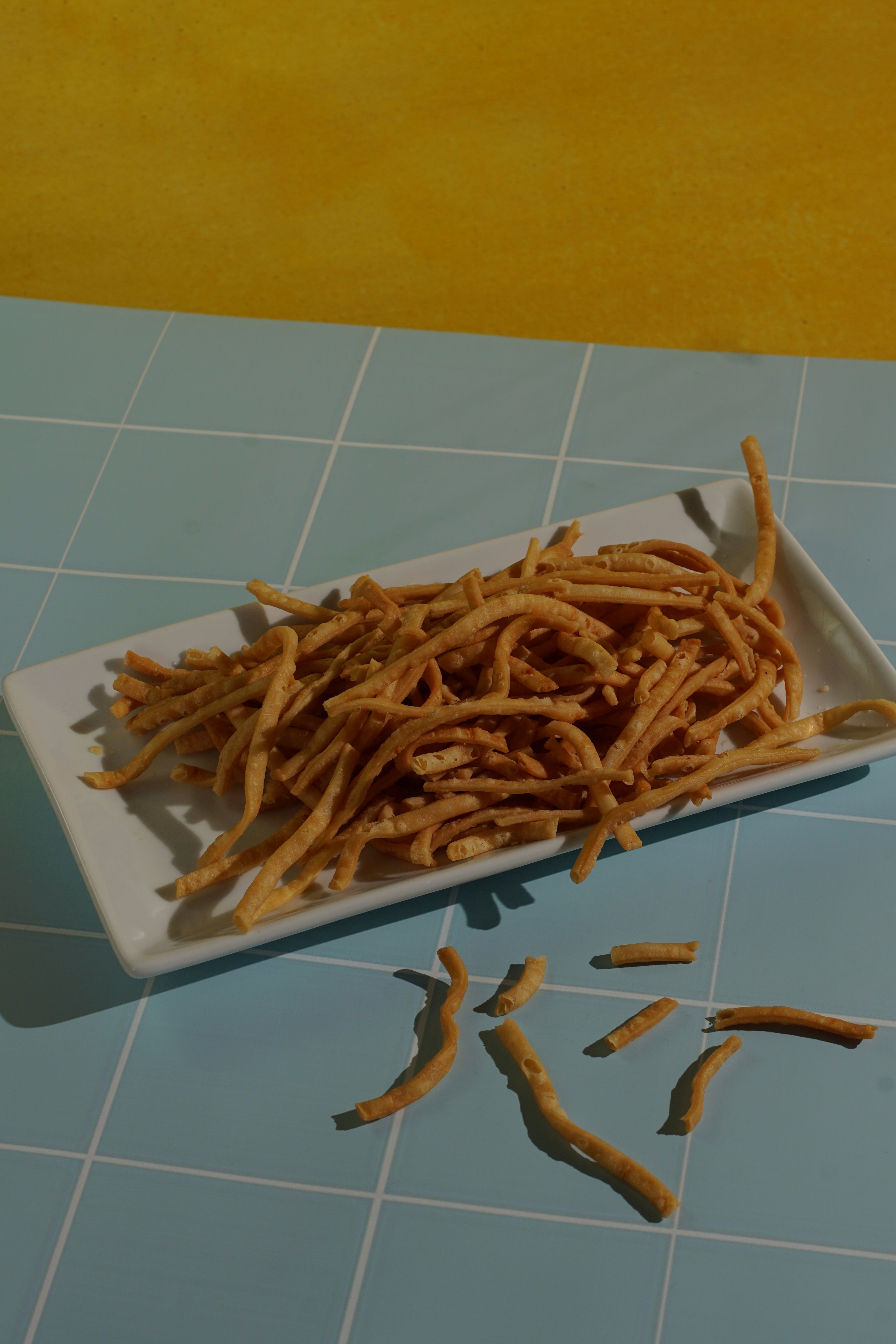 Crispy Snack Sticks on a White Plate · Free Stock Photo