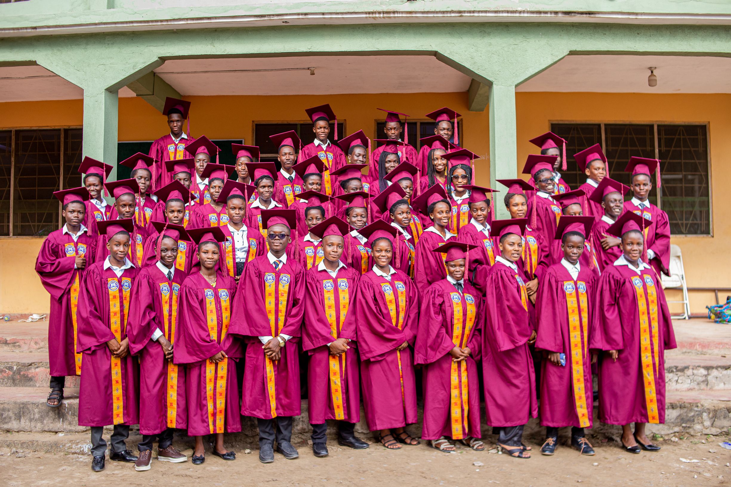 Graduates in Burgundy Gowns at Winneba Ceremony · Free Stock Photo