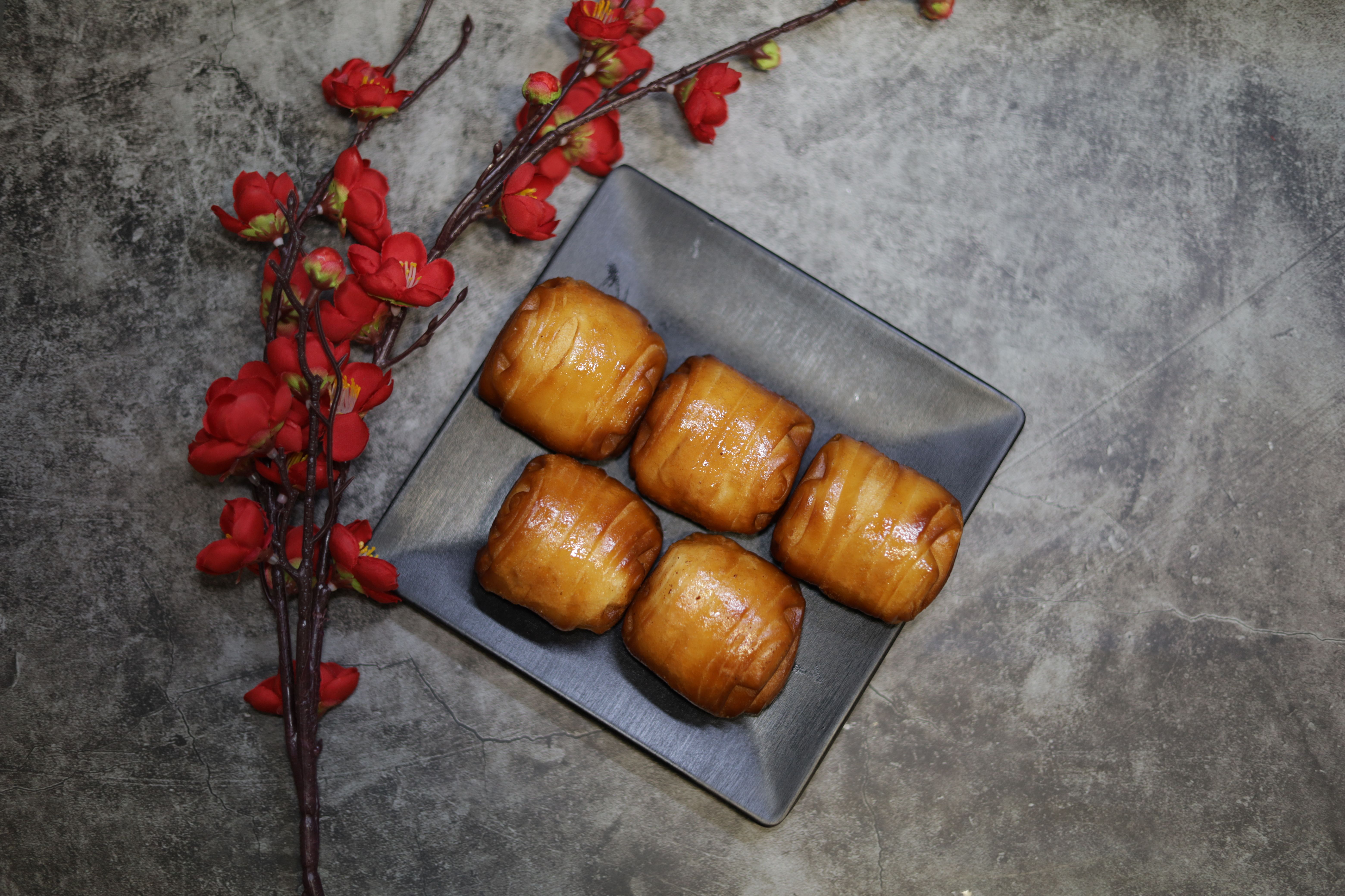 Delicious Pastries with Blossoms on Stone Surface · Free Stock Photo