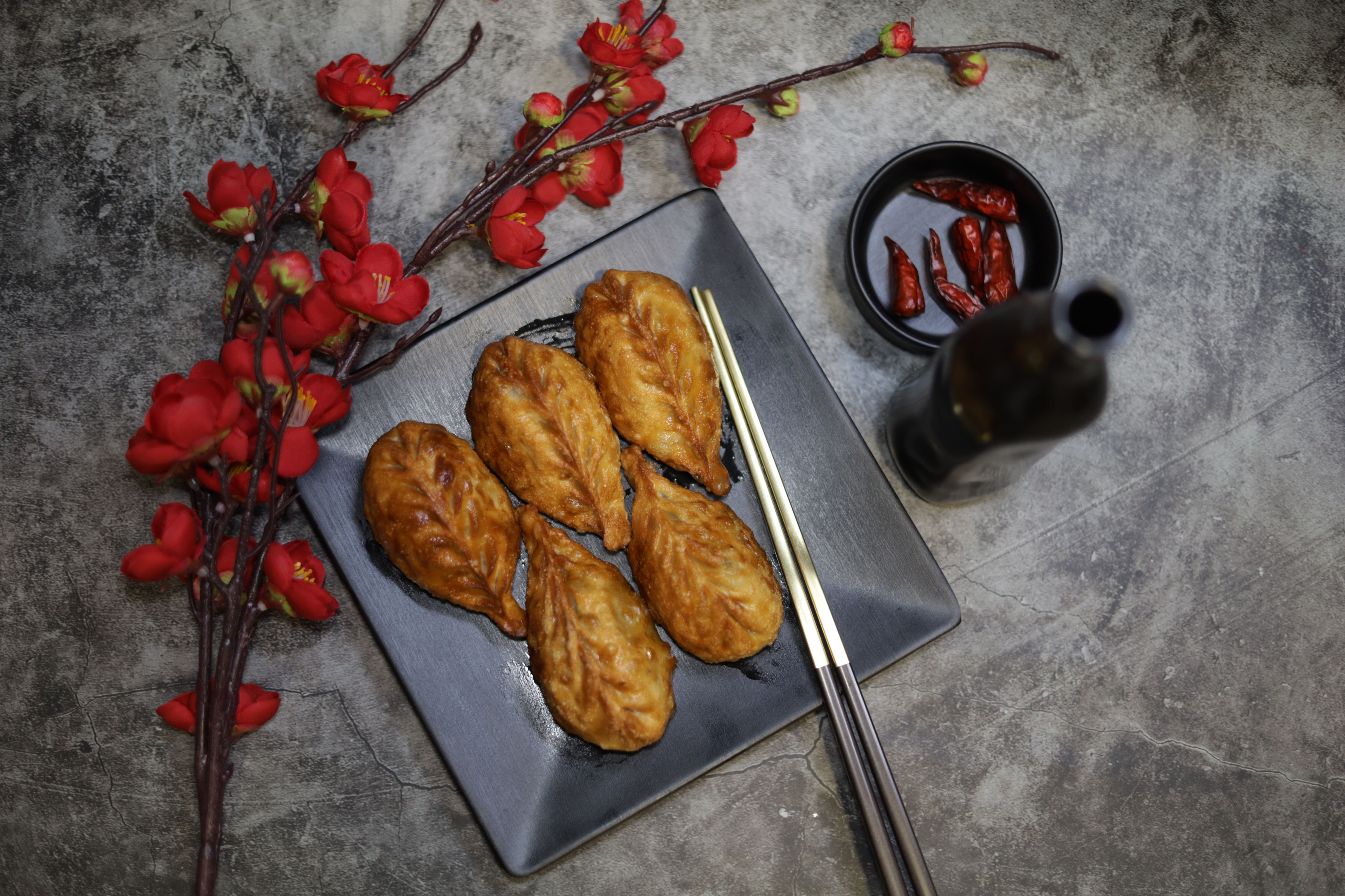 Authentic Asian Dumplings with Red Flower Decor · Free Stock Photo