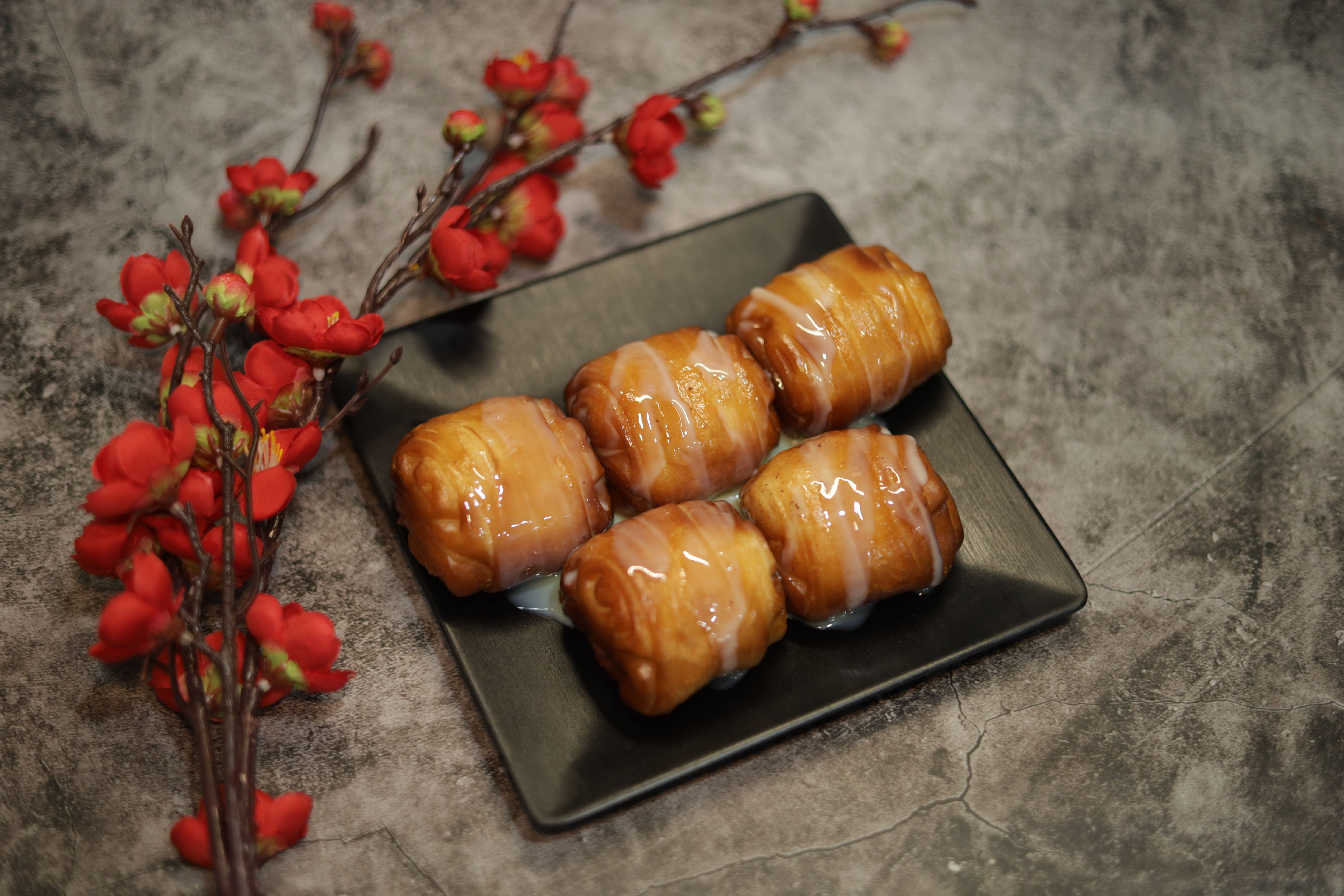 Delicious Glazed Pastries with Red Blossoms · Free Stock Photo