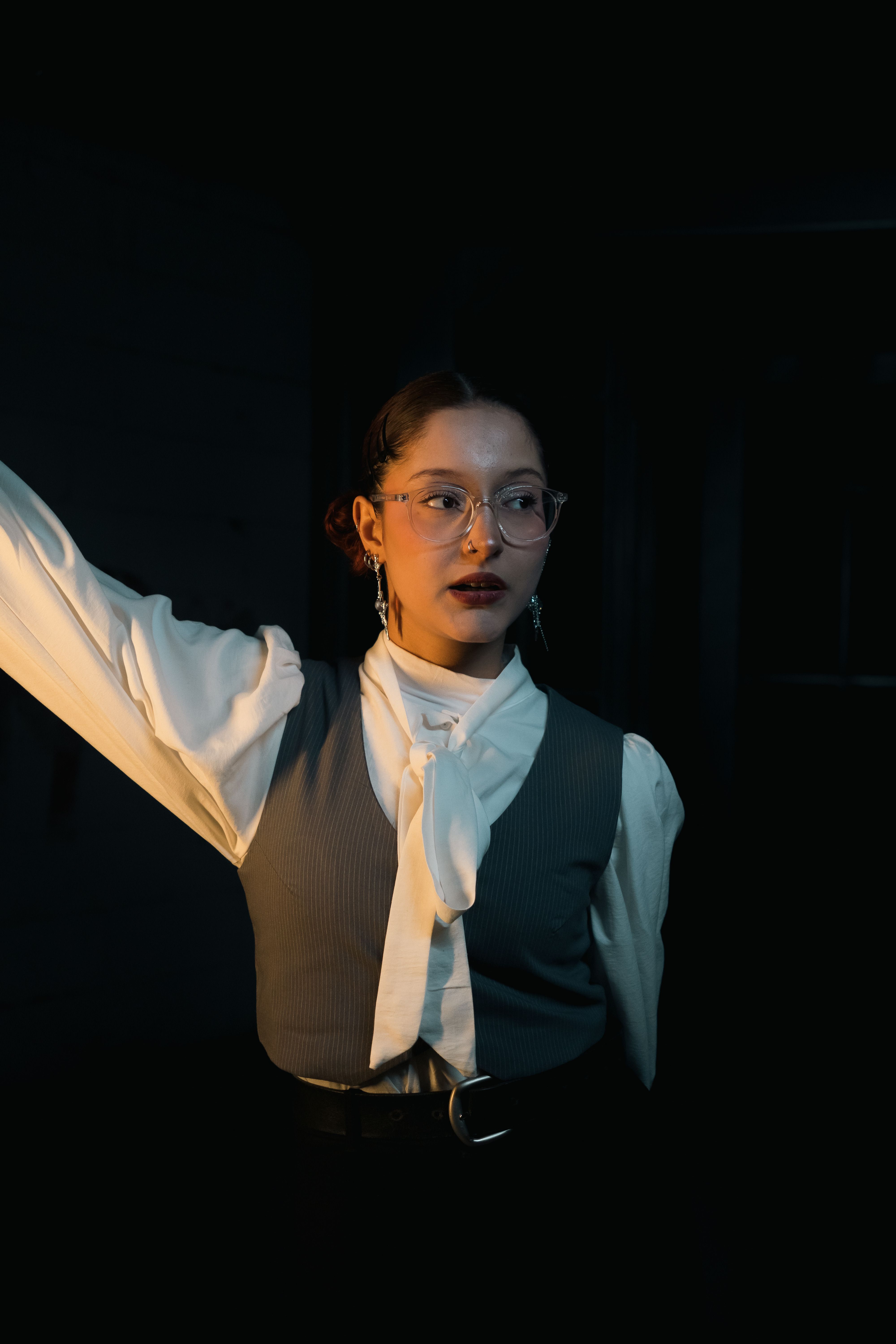 Stylish Woman in Dramatic Lighting Portrait · Free Stock Photo