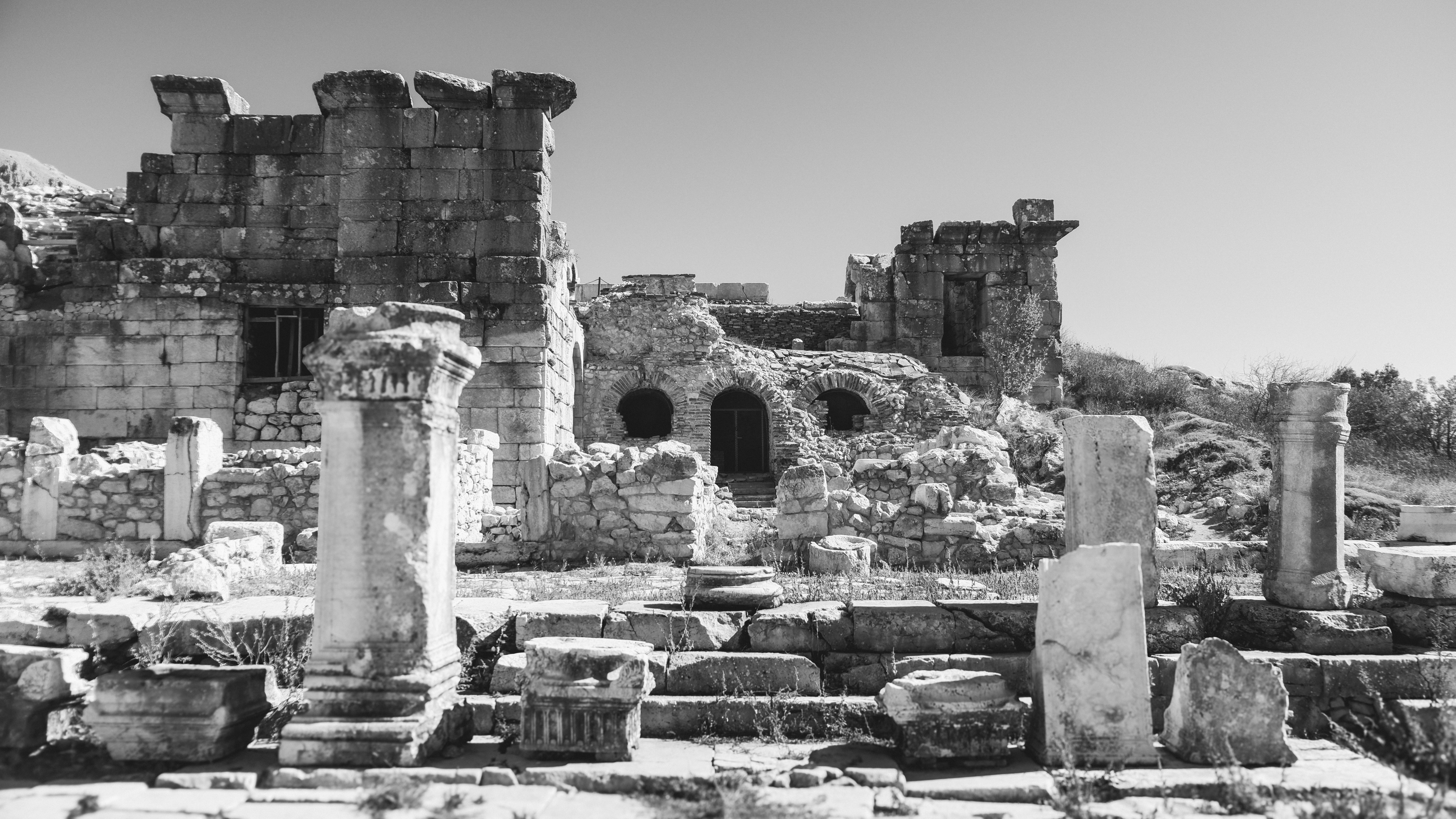 Ancient Ruins of Stone Structures in Black and White · Free Stock Photo