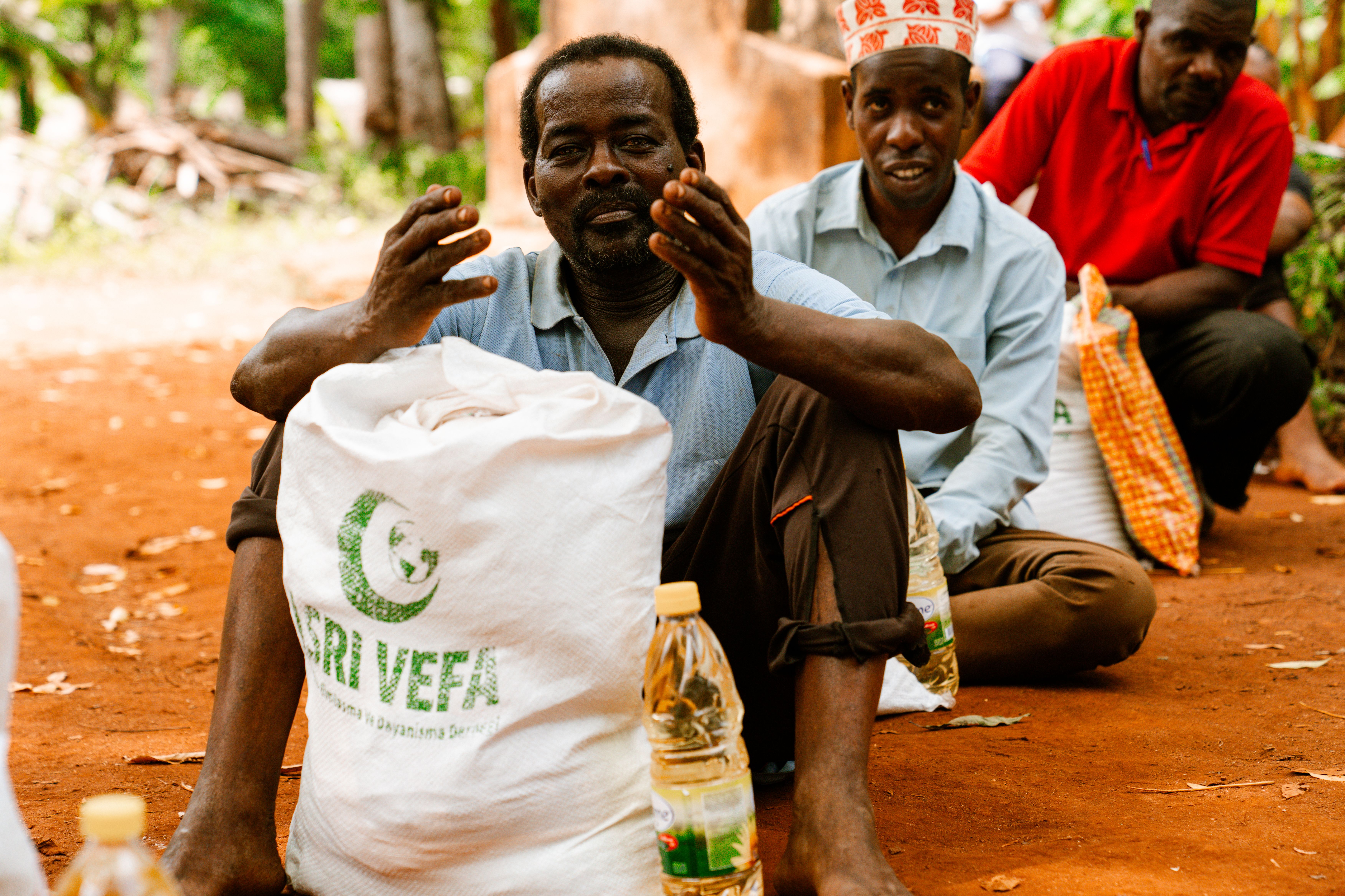 Community Gathering with Food Supplies Outdoors · Free Stock Photo