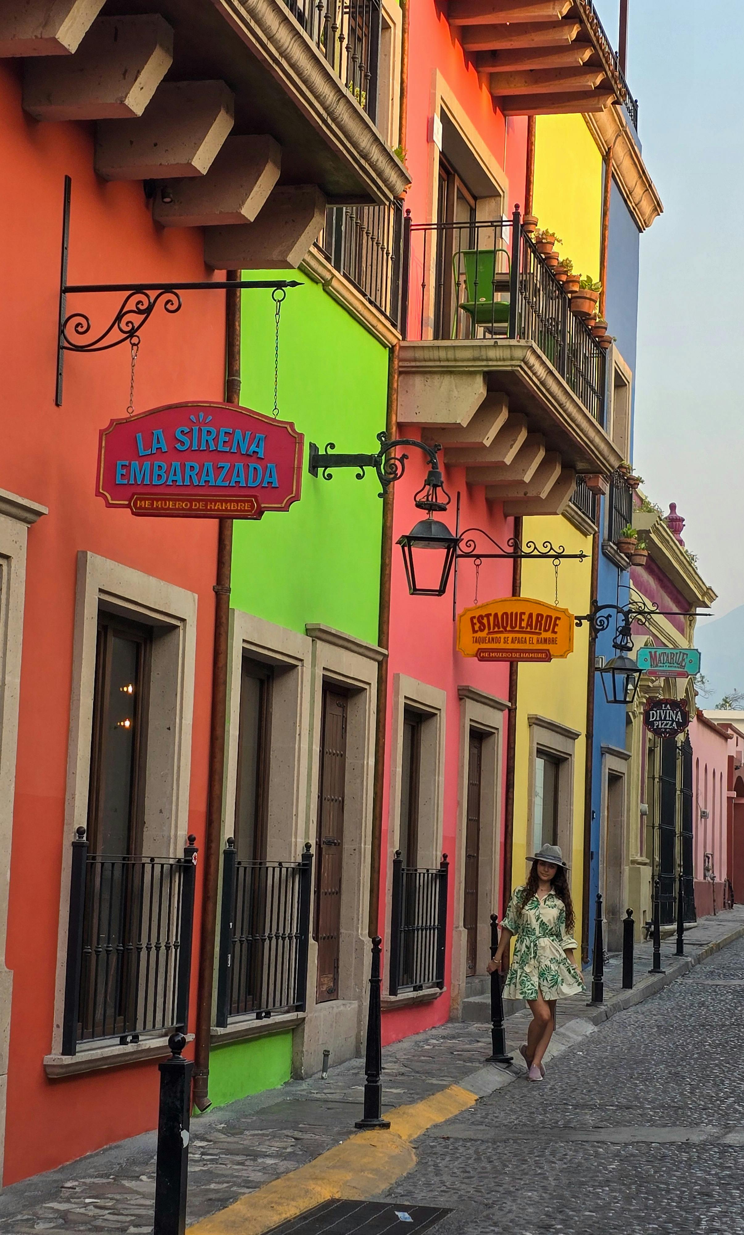 Colorful Street Scene with Woman Walking · Free Stock Photo