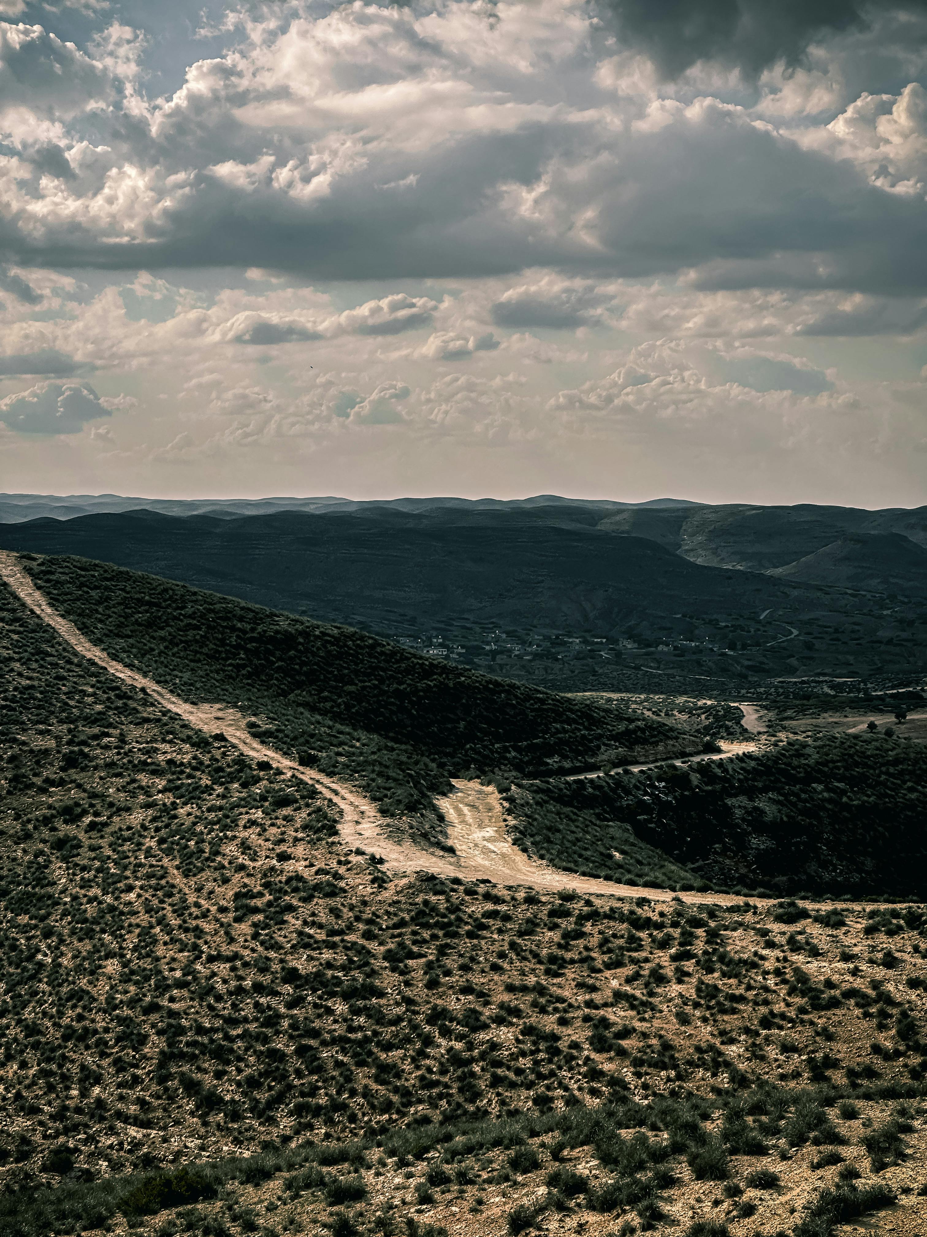 Dramatic Desert Landscape with Rolling Hills · Free Stock Photo