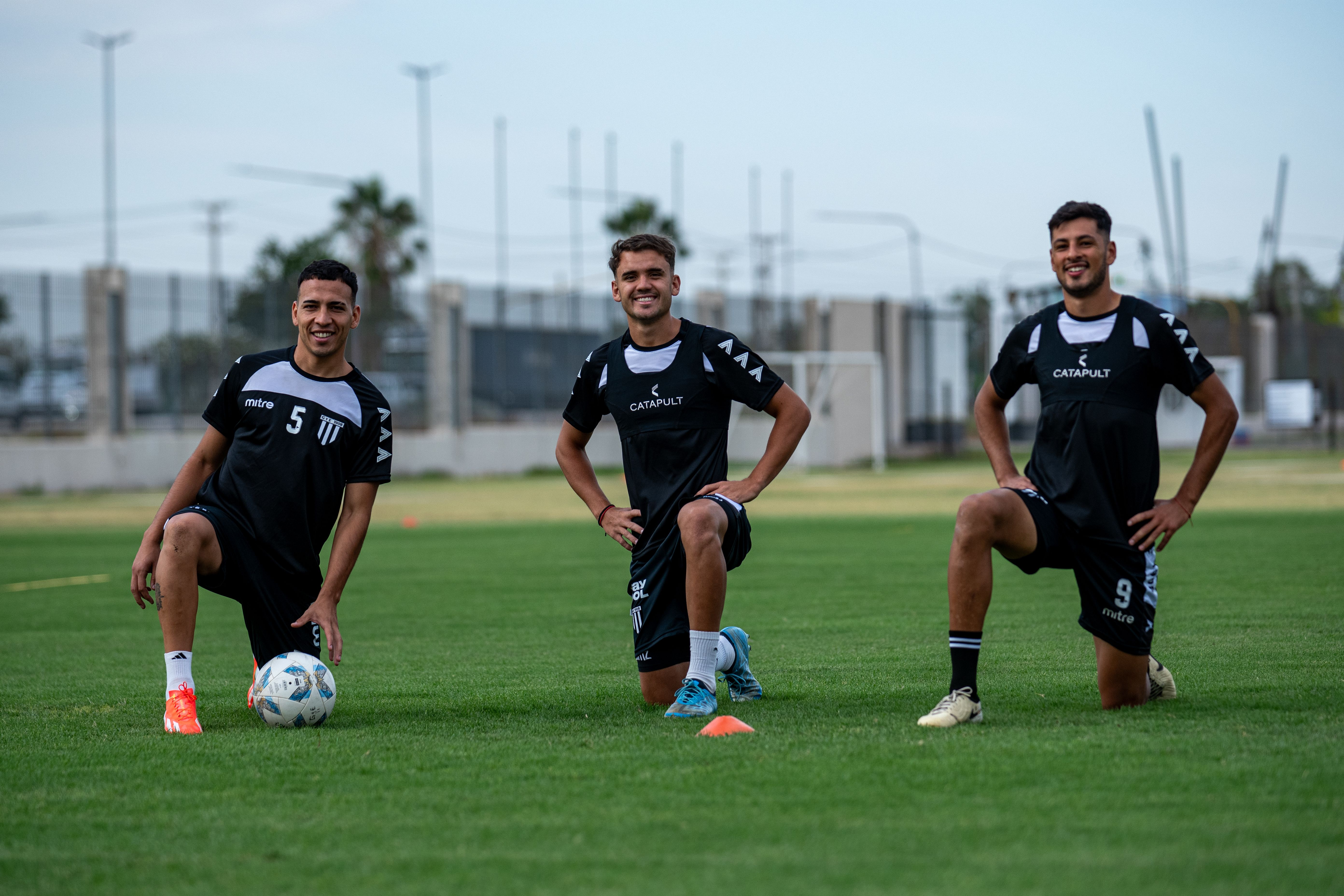 Soccer players warming up on green field · Free Stock Photo