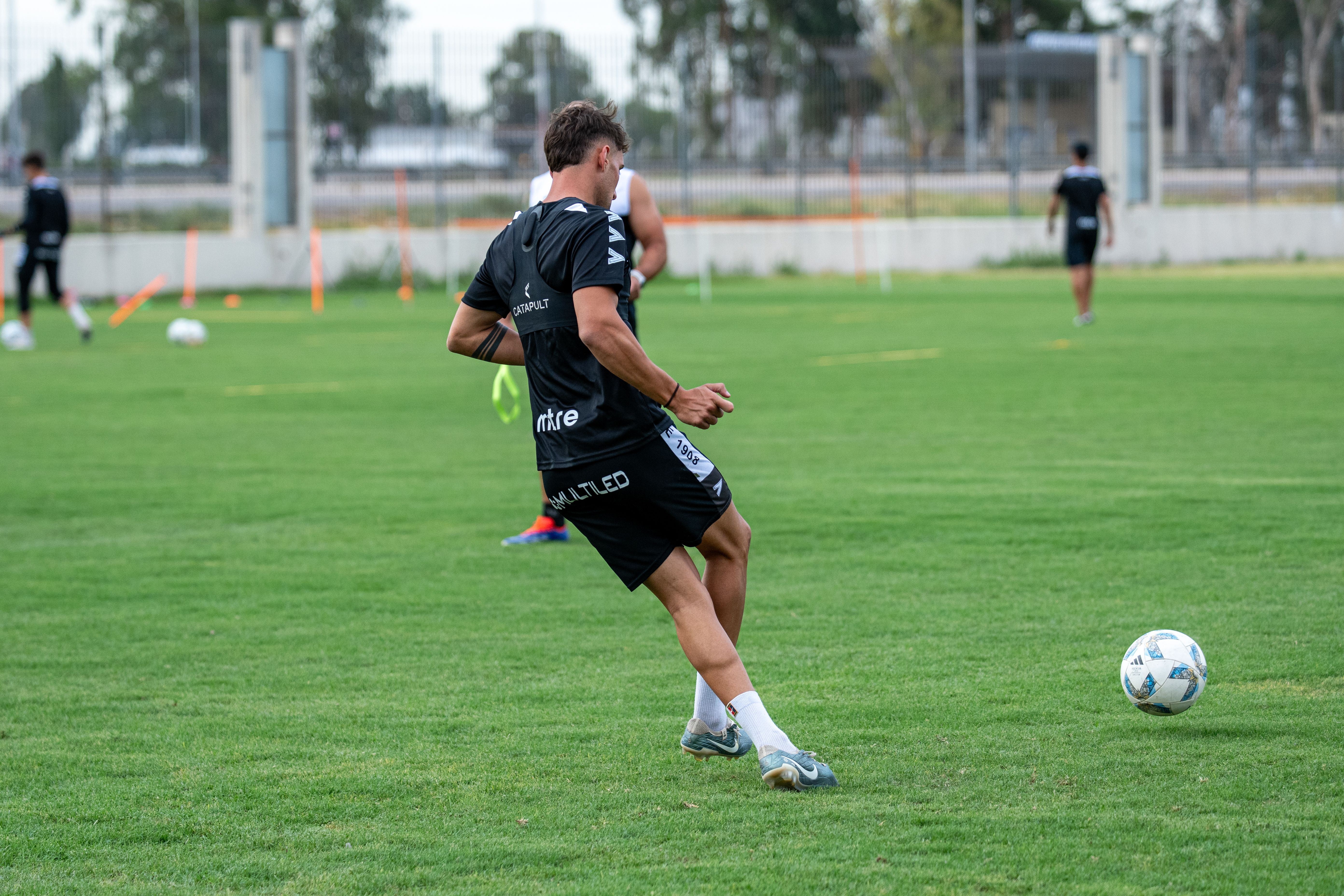 Soccer Player Training on a Green Field · Free Stock Photo