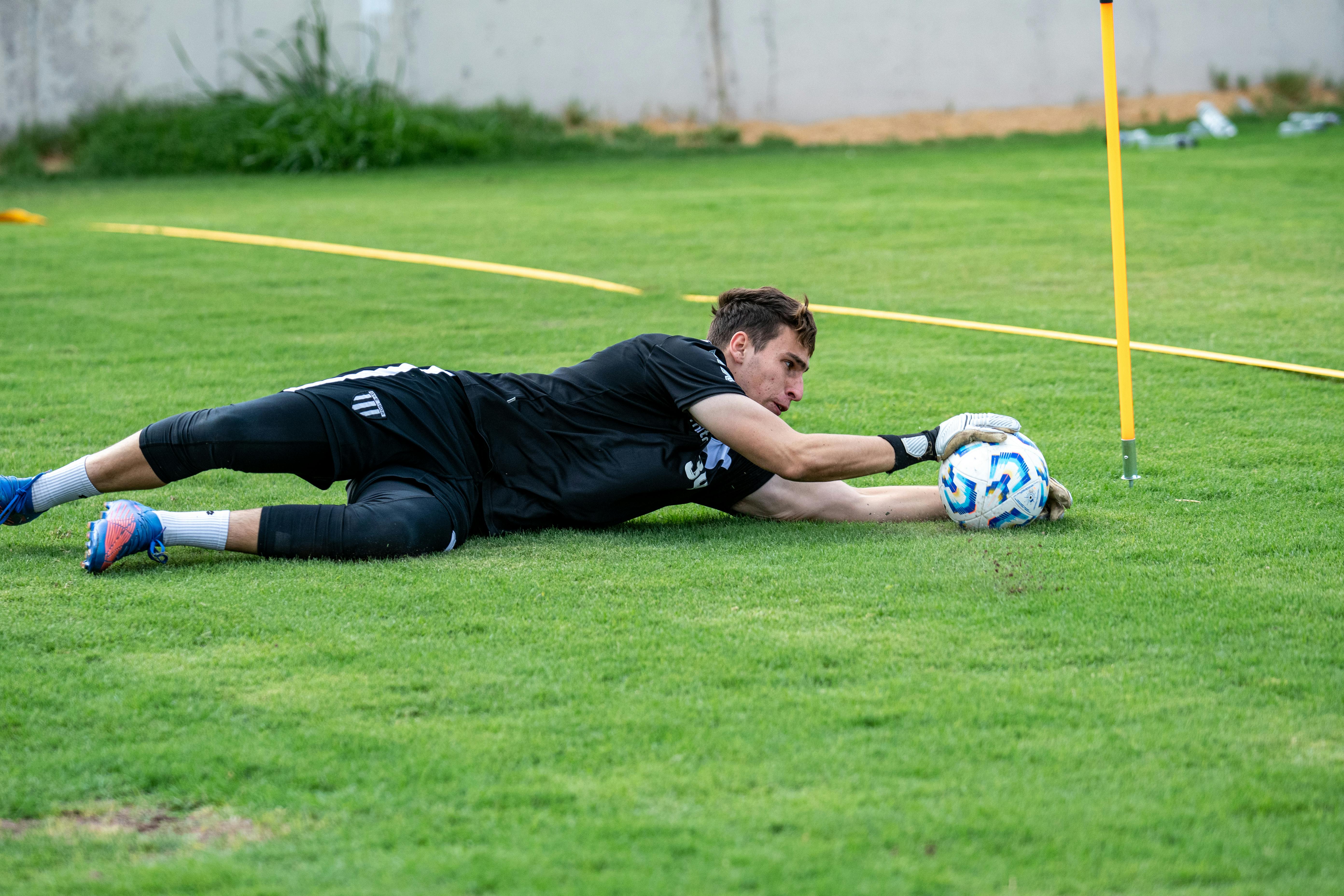 Goalkeeper Training Session on Green Field · Free Stock Photo