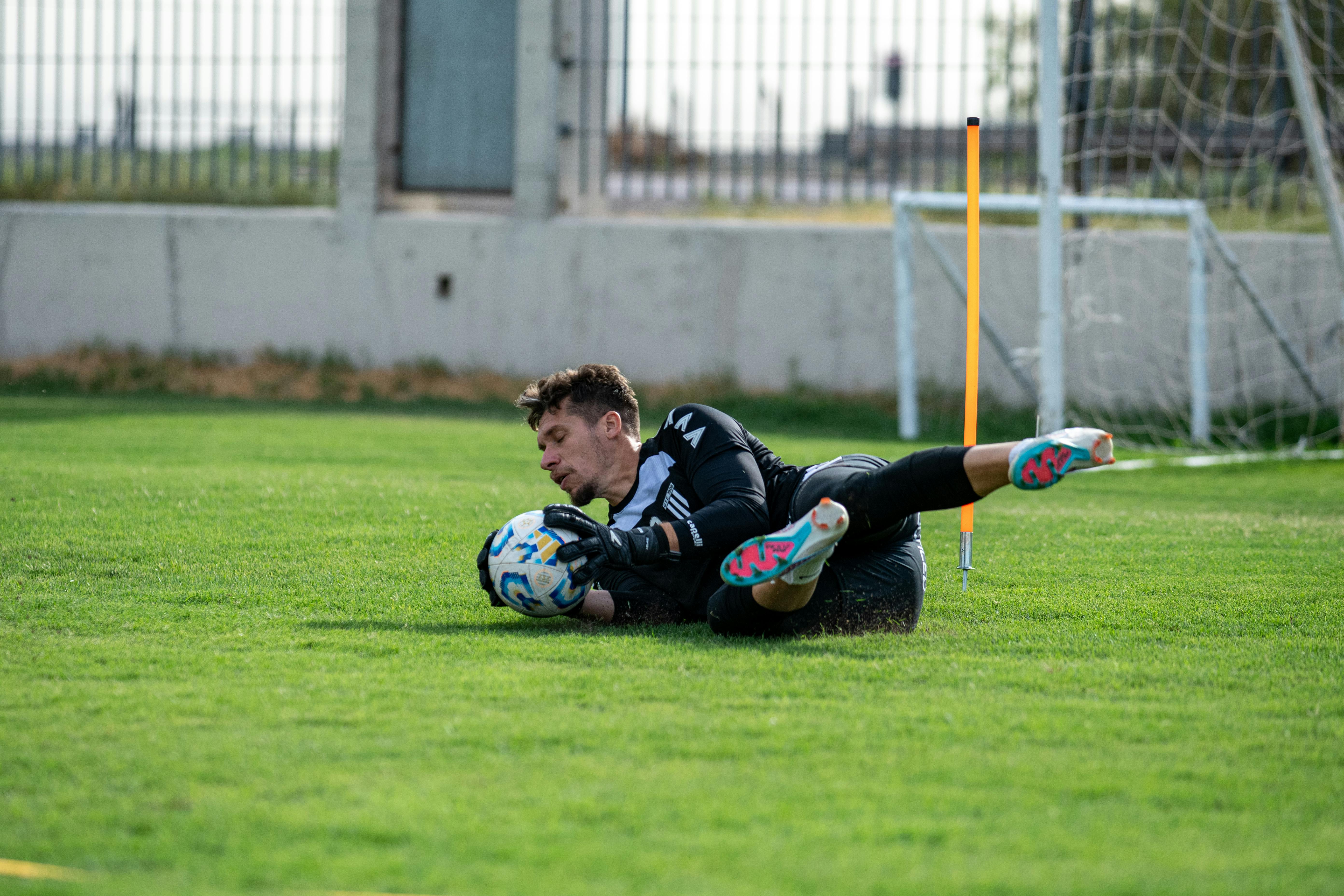 Goalkeeper Making a Save During Soccer Practice · Free Stock Photo