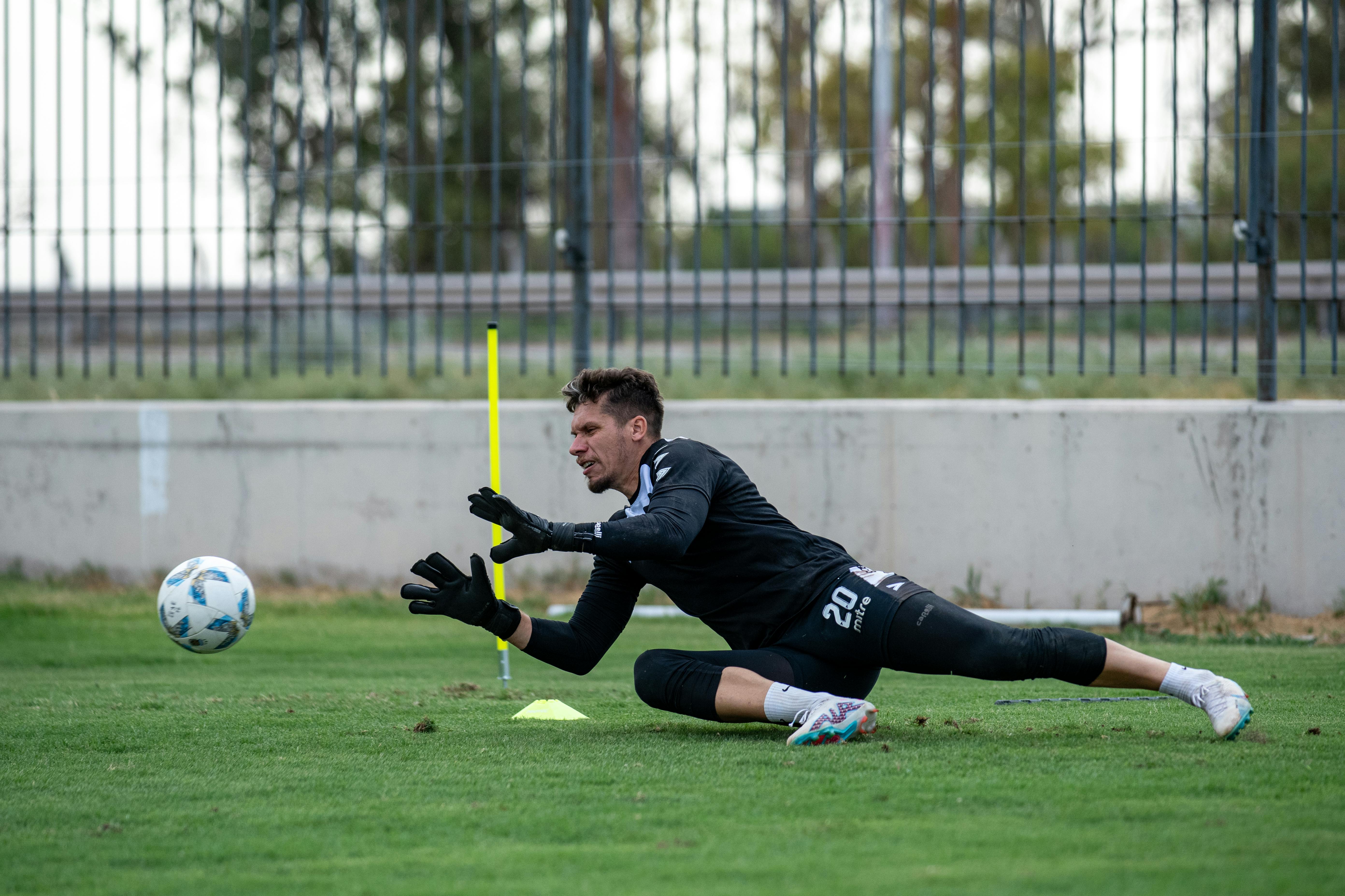 Goalkeeper Training Dive on Soccer Field · Free Stock Photo