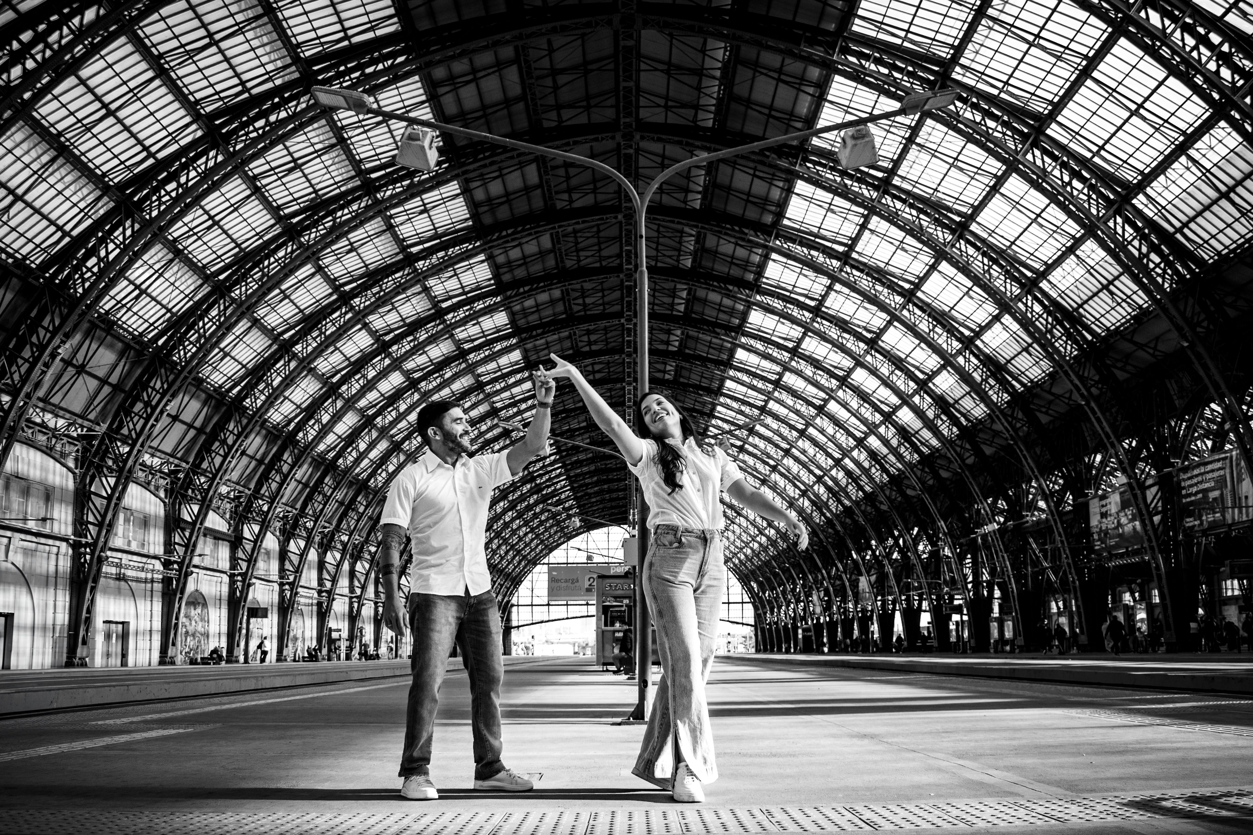 Romantic Couple Dancing in Urban Train Station · Free Stock Photo