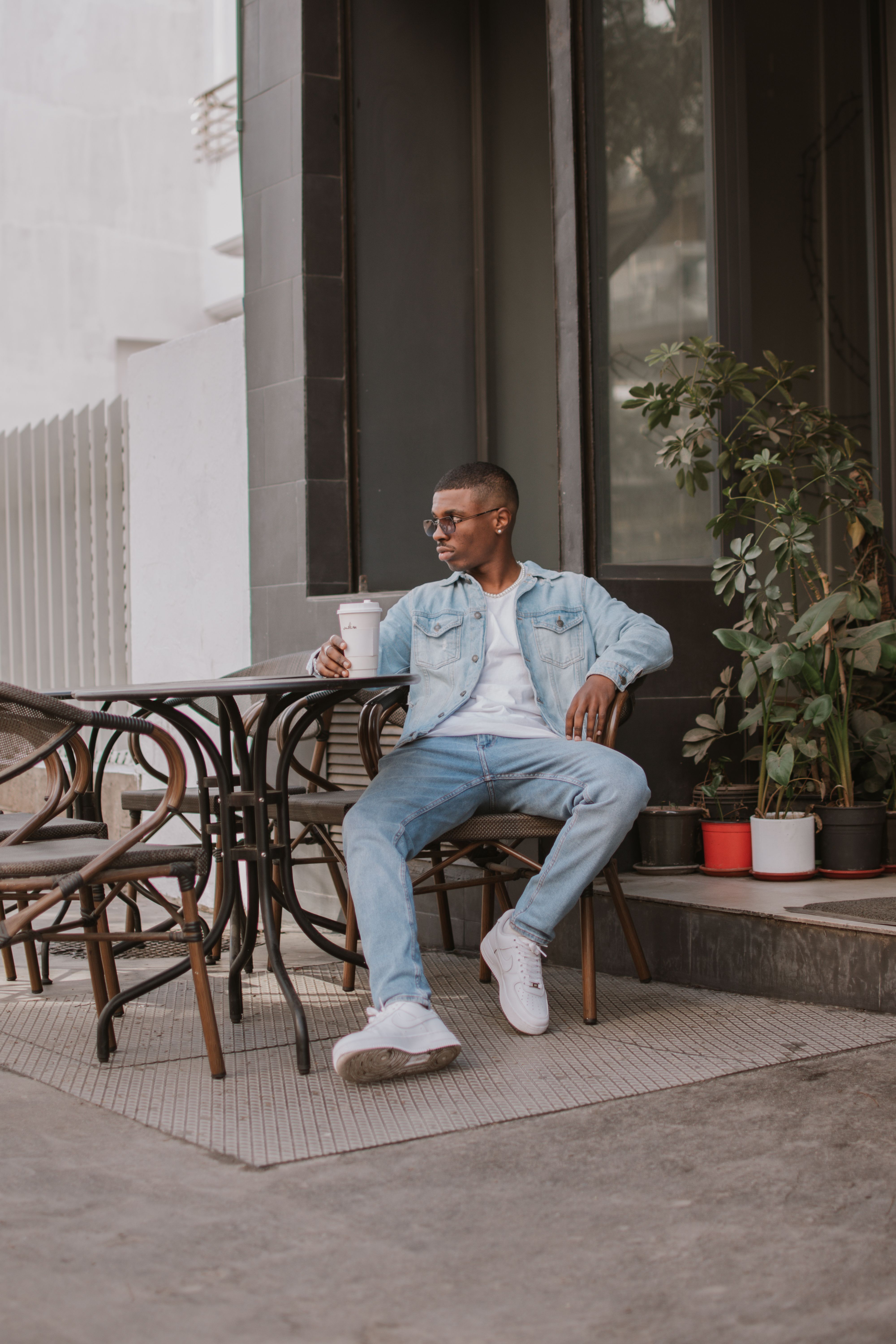 Casual Outdoor Coffee Moment in Blue Denim Outfit · Free Stock Photo
