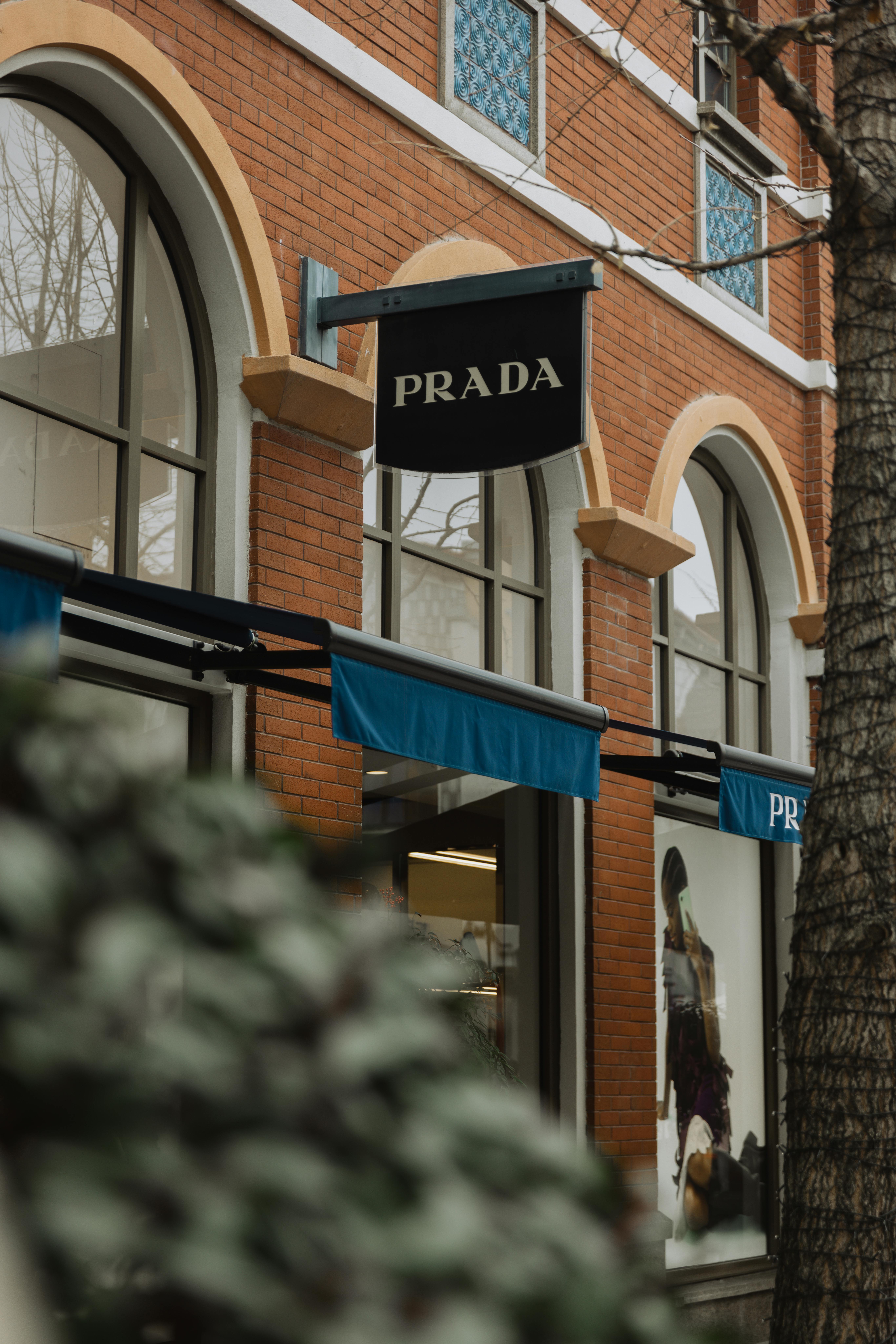 Chic Urban Prada Storefront with Classic Architecture · Free Stock Photo