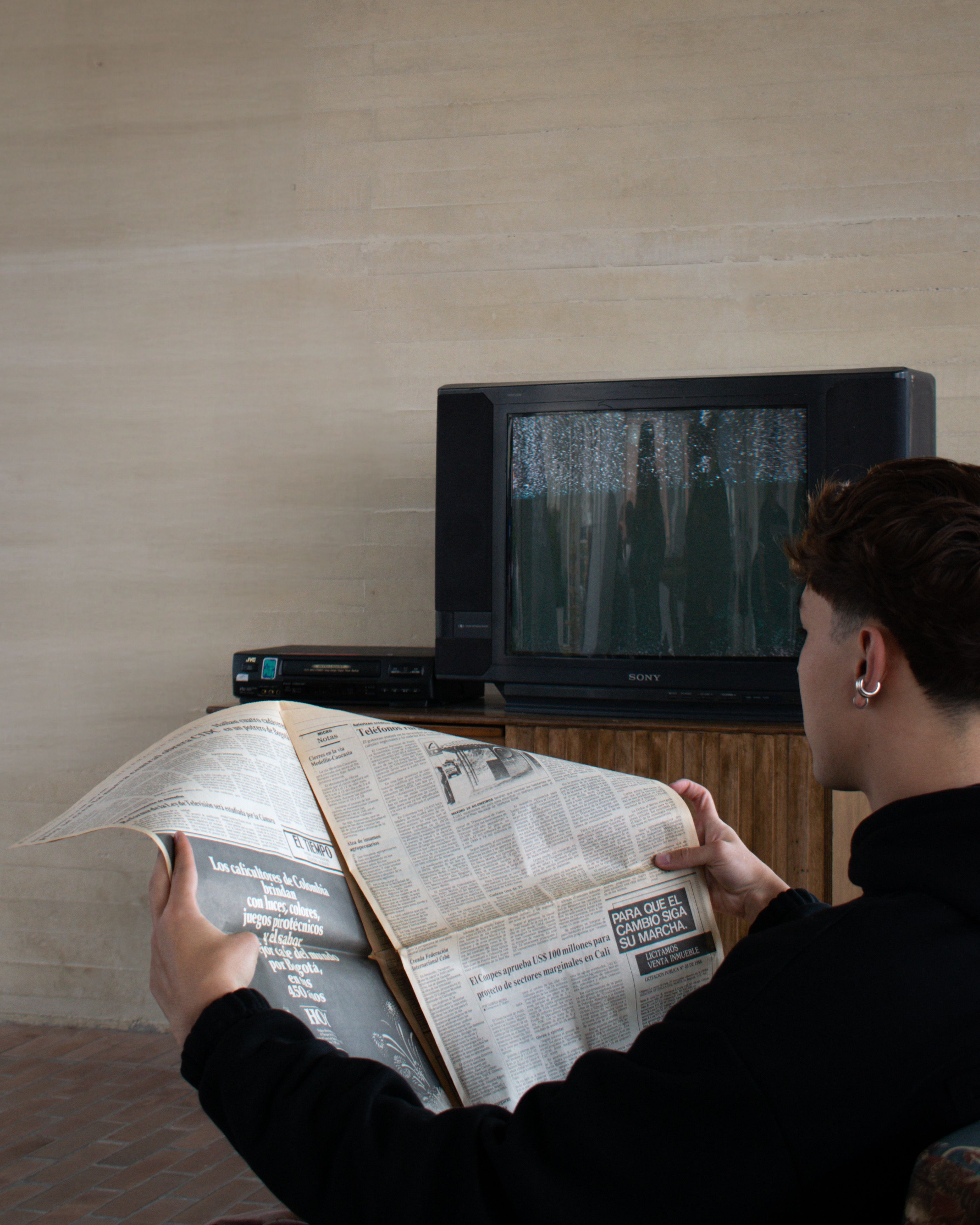Man Reading Newspaper by Retro Television · Free Stock Photo