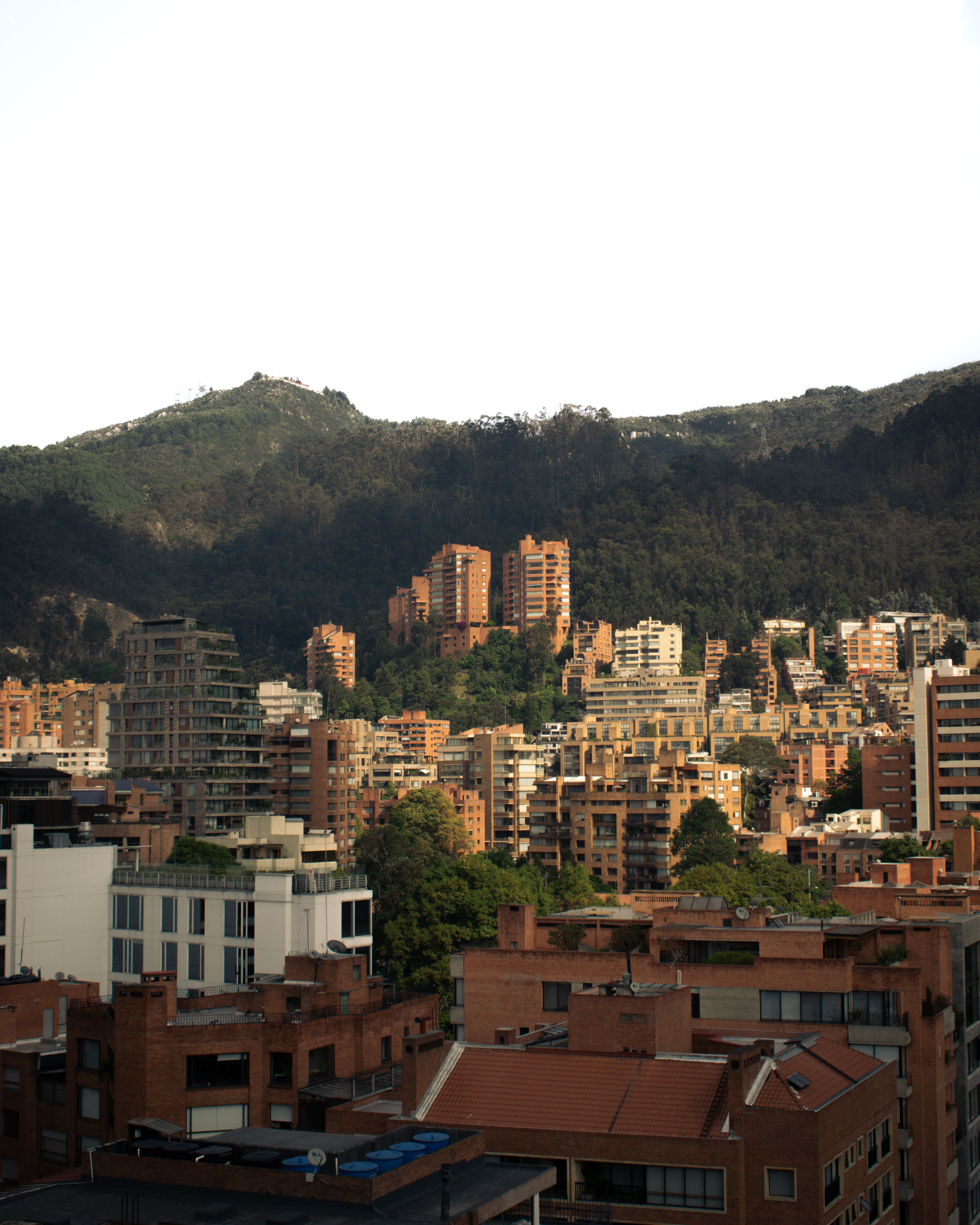 Cityscape with Mountain Backdrop at Daytime · Free Stock Photo