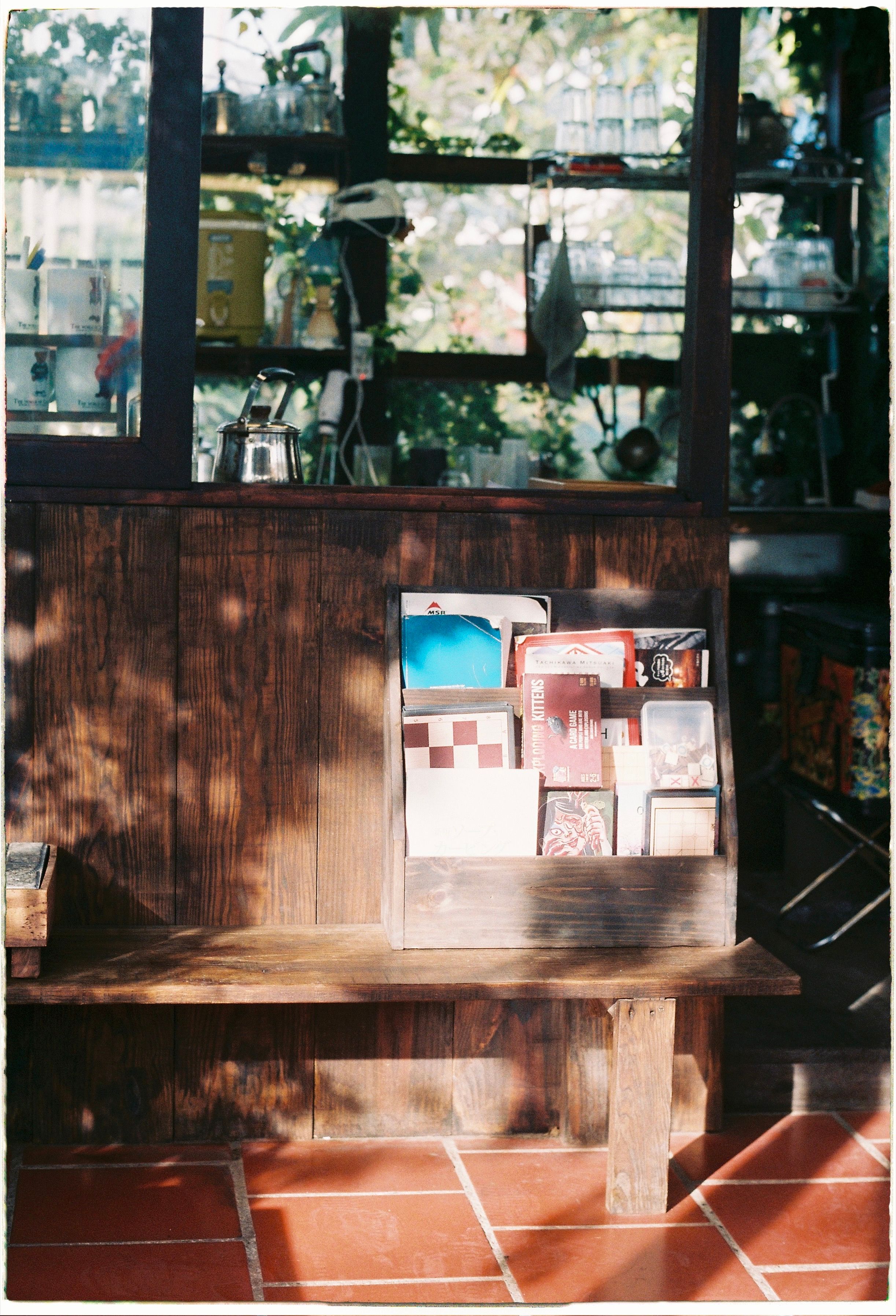 Cozy Café Corner with Vintage Magazine Display · Free Stock Photo