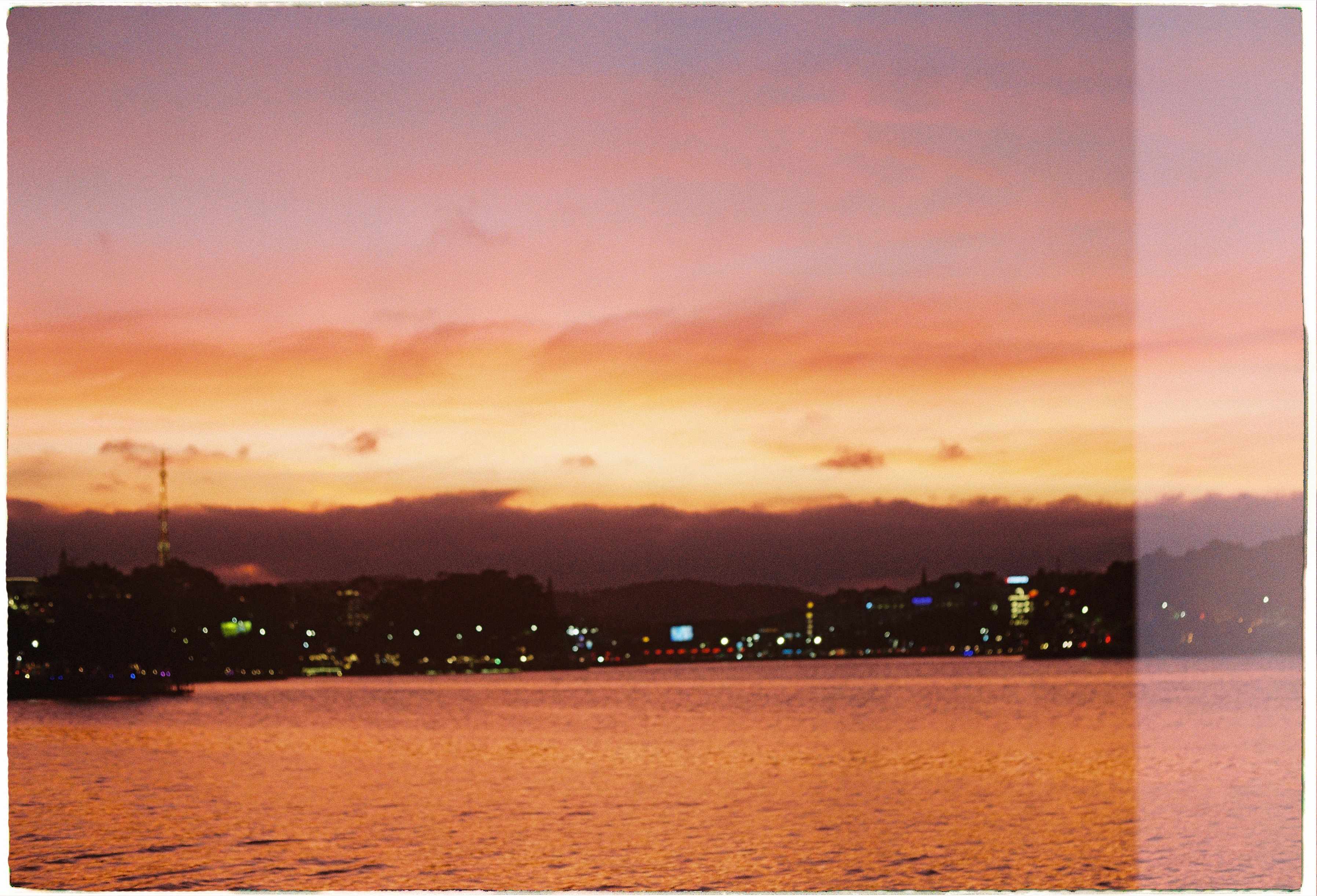 Vibrant Sunset Over City Skyline Reflection · Free Stock Photo