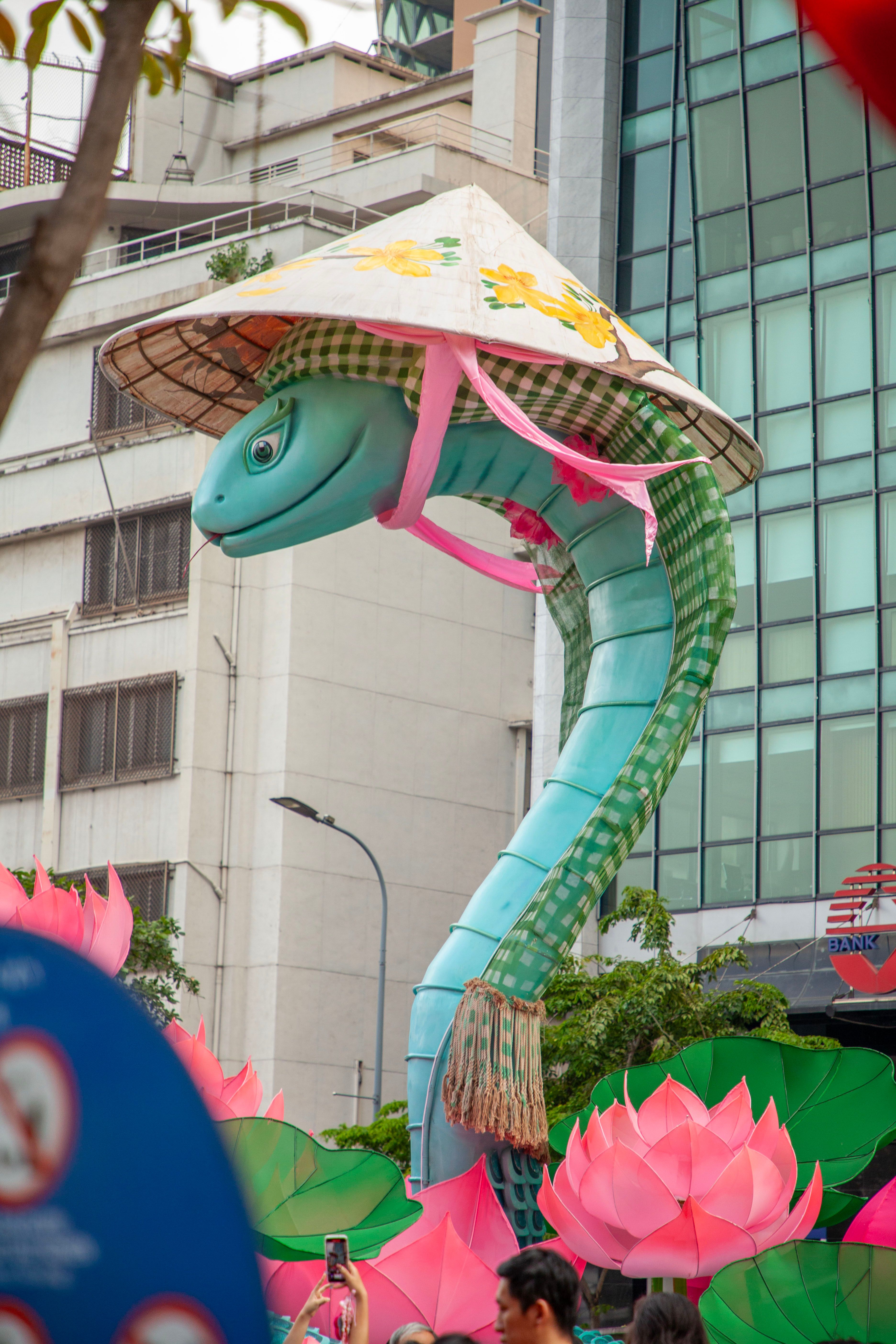 Street Festival with Giant Snake Sculpture · Free Stock Photo