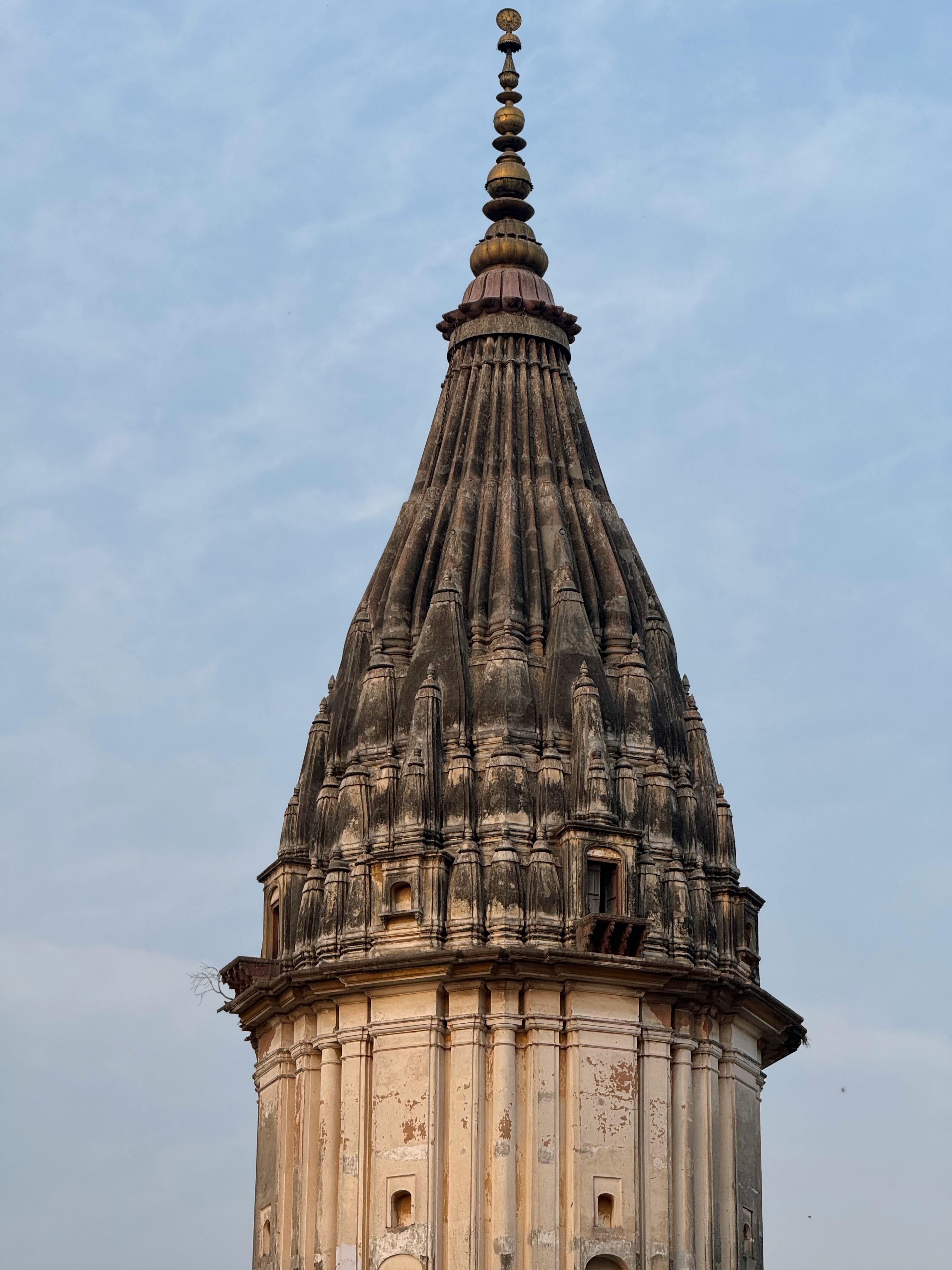 Ornate Indian Temple Spire Against Blue Sky · Free Stock Photo