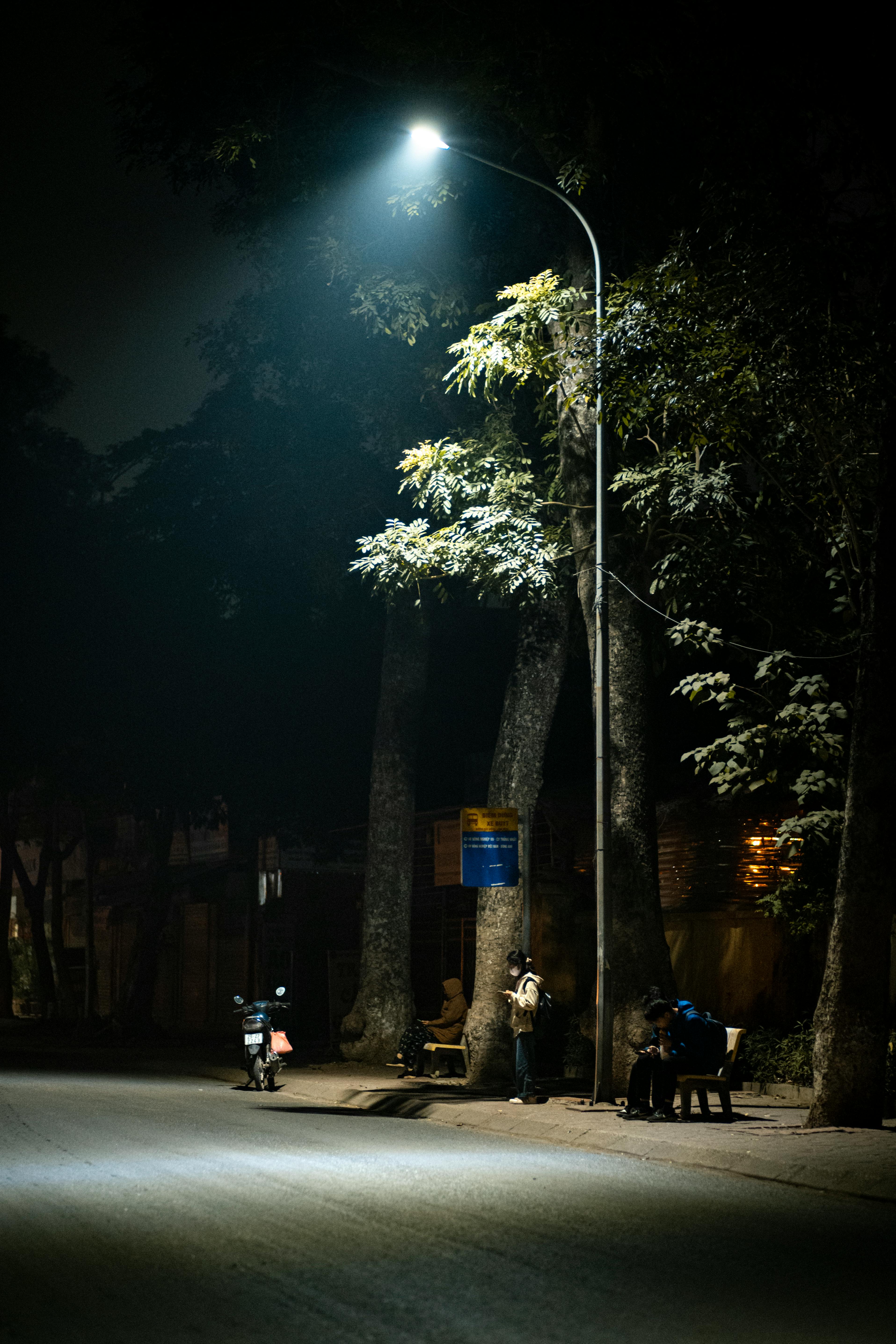 Night Street Scene Under Lamp Post in Hanoi · Free Stock Photo