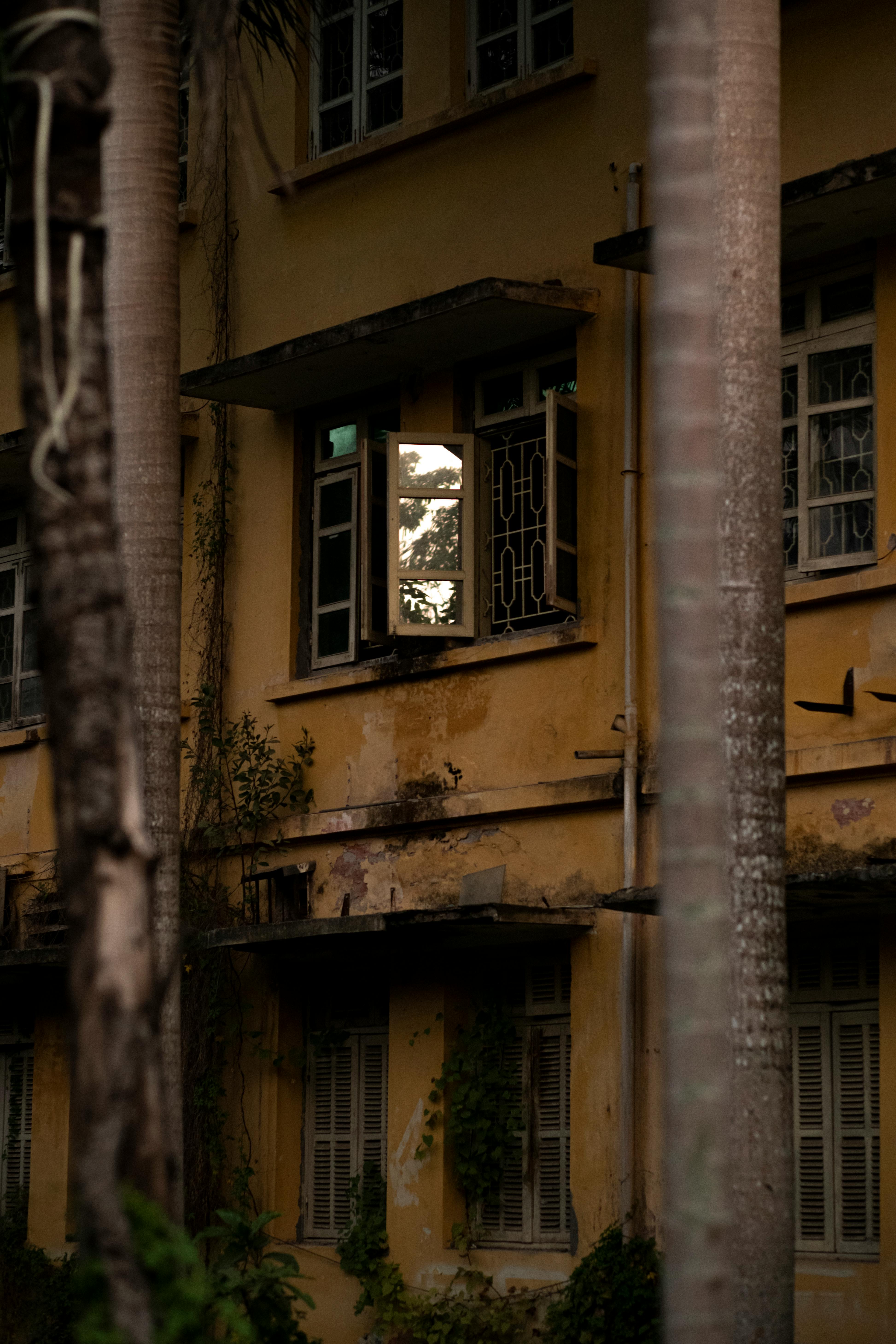 Old Building Exterior with Open Window · Free Stock Photo