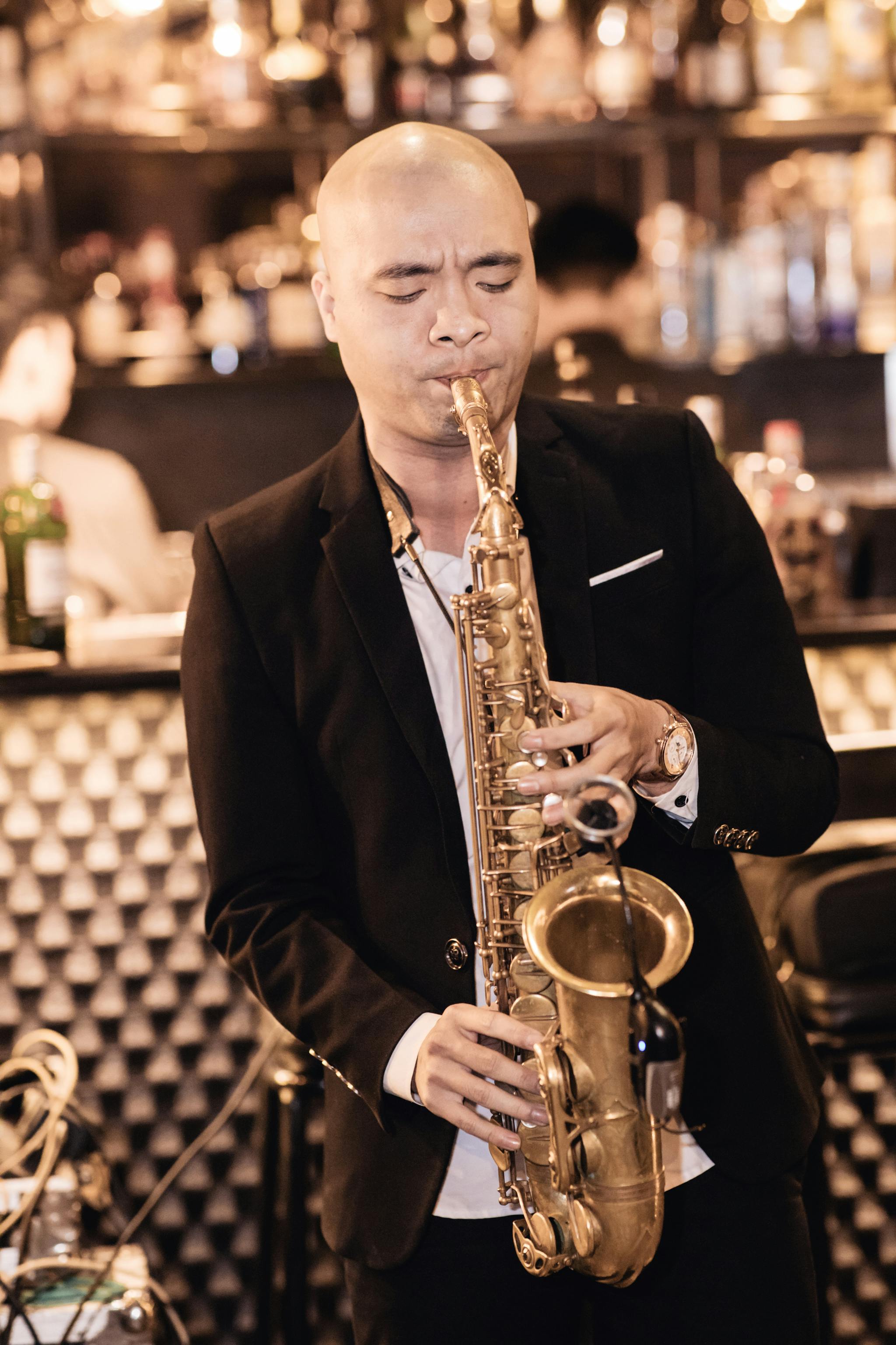 Jazz Musician Playing Saxophone in Club · Free Stock Photo