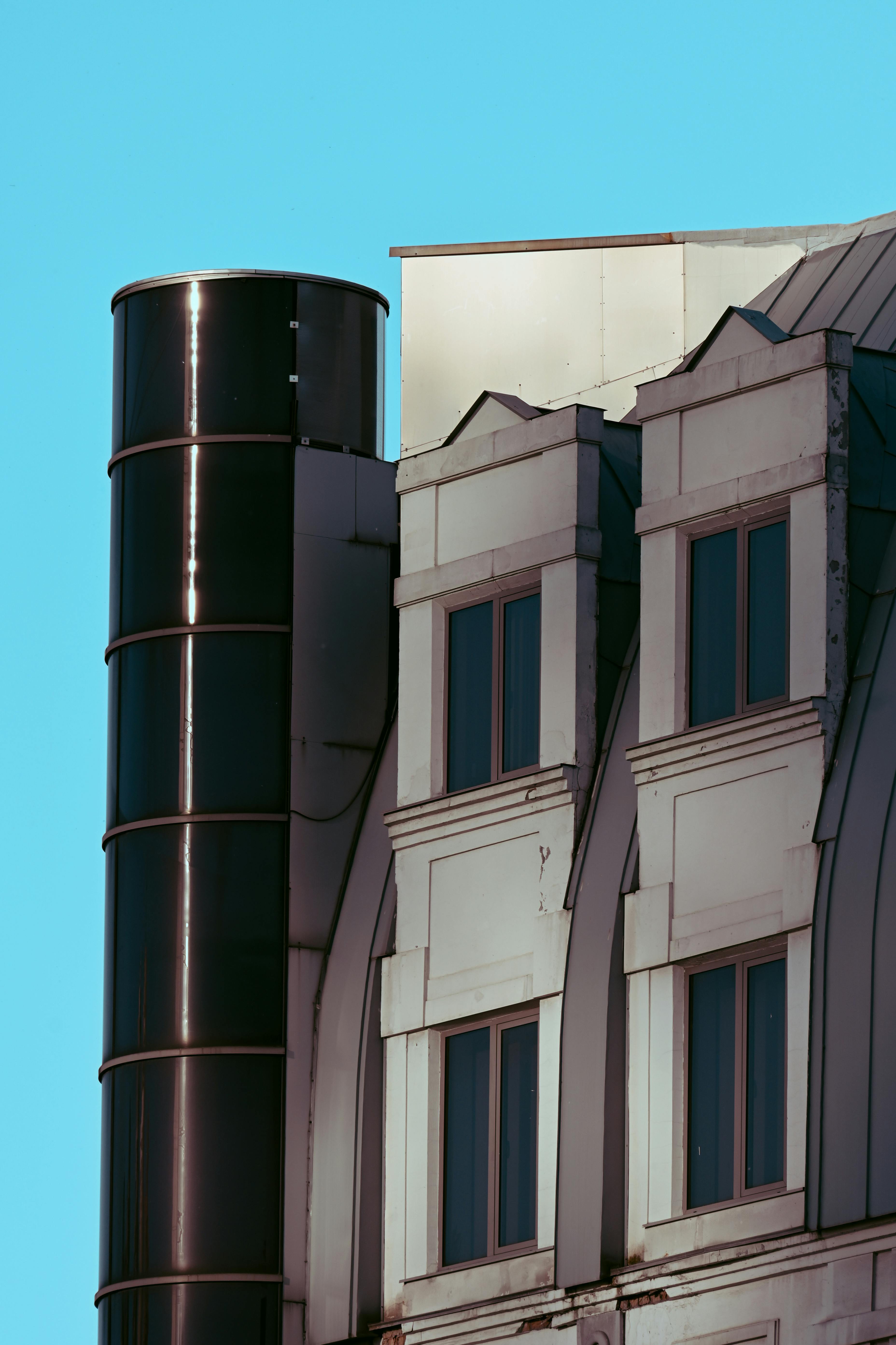 Modern Architectural Facade with Ventilation Tower · Free Stock Photo