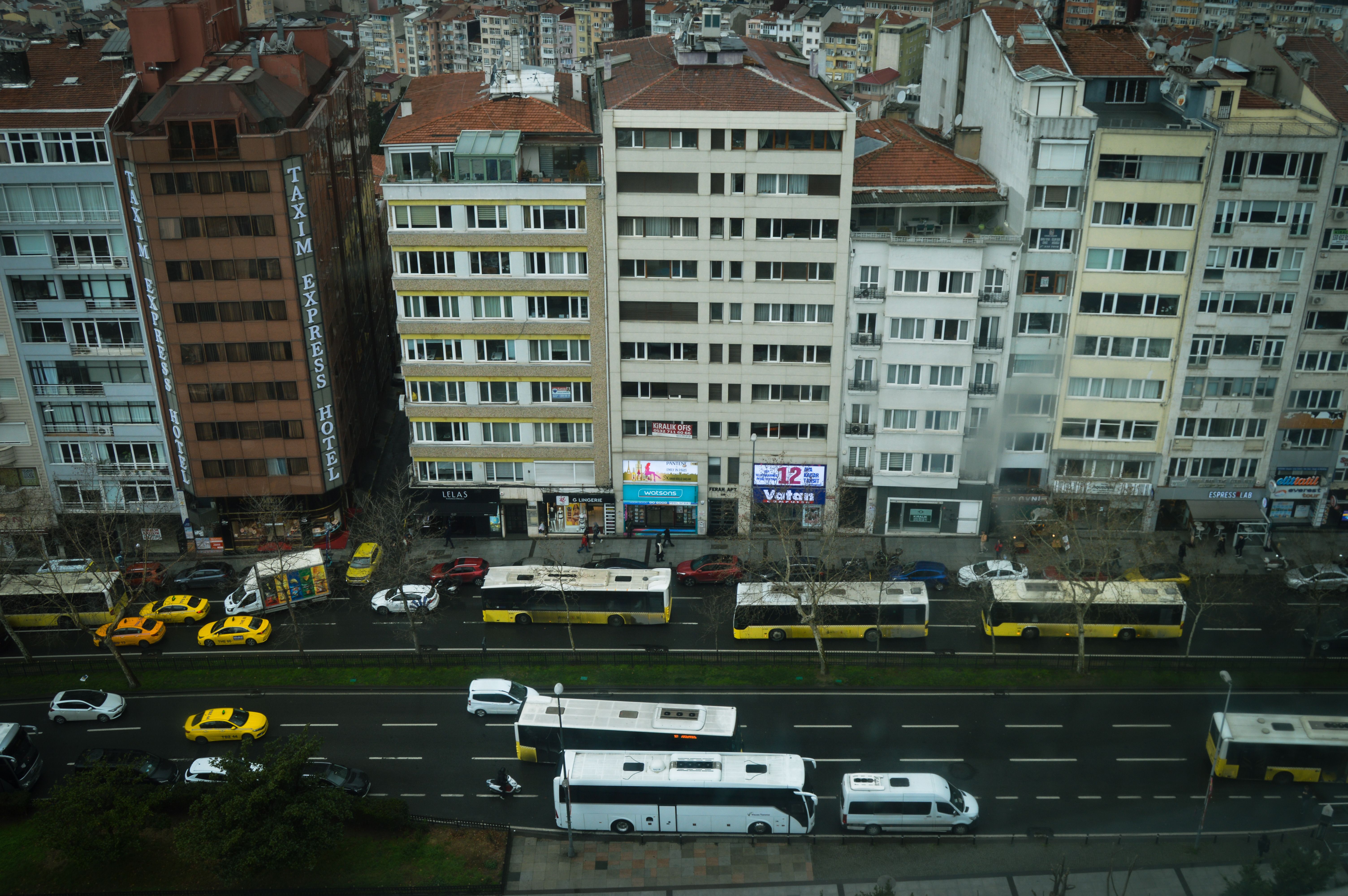 Aerial View of Urban Street with Traffic and Buildings · Free Stock Photo