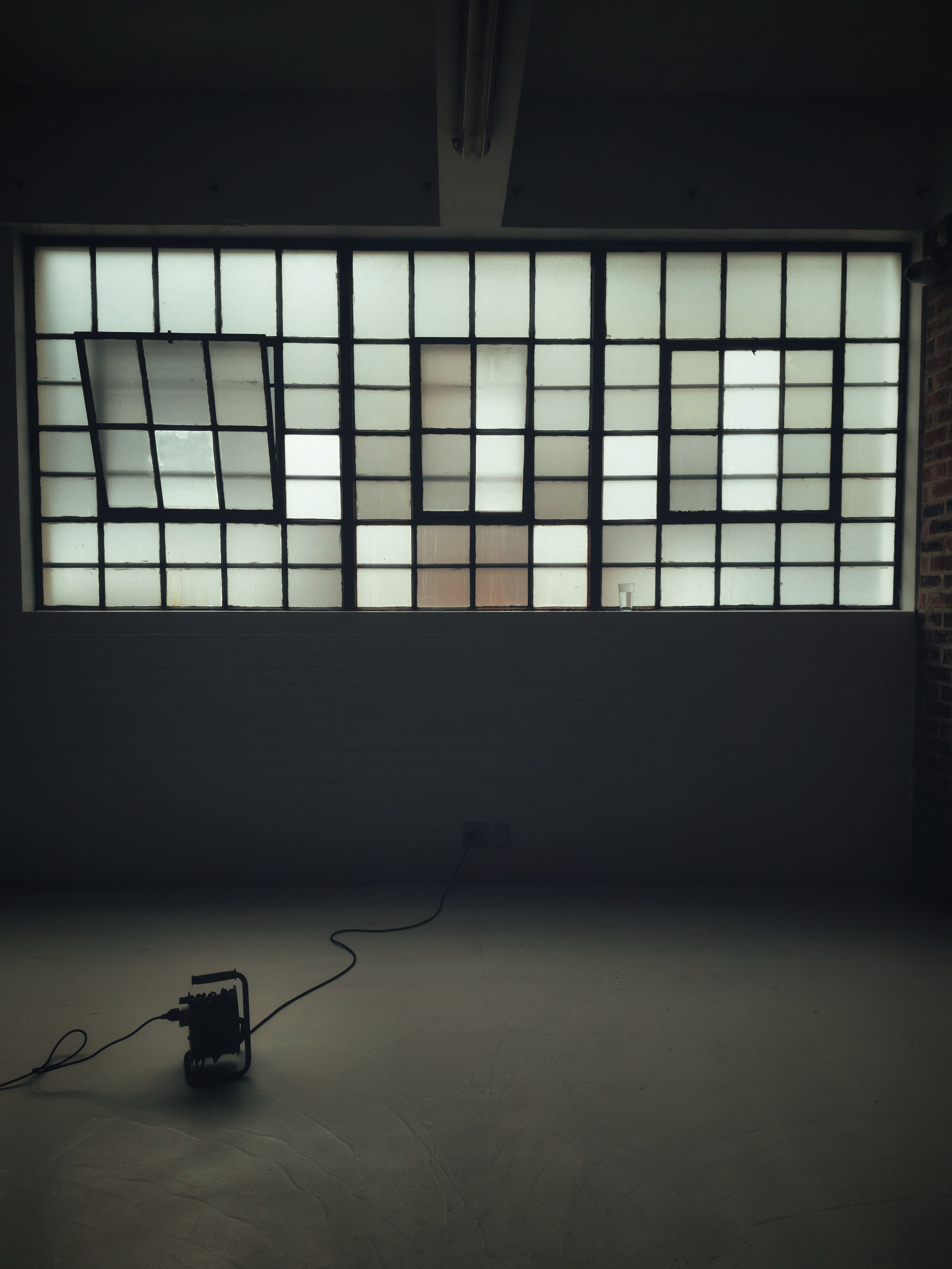 Minimalist Industrial Loft with Large Windows · Free Stock Photo